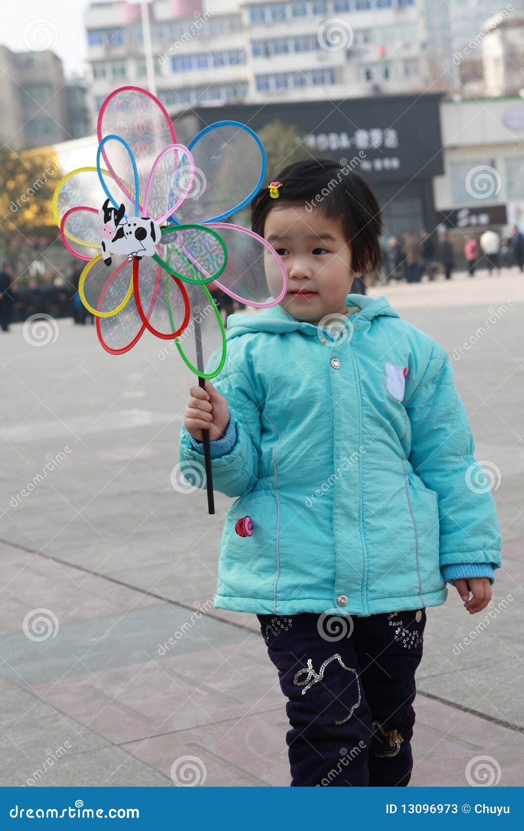 Little girl and windmill stock image. Image of square - 13096973