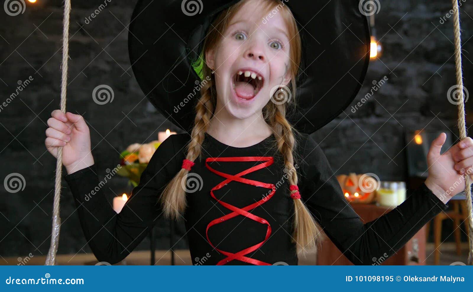 A Little Girl, a Witch, Ride on a Swing on Halloween Stock Video ...