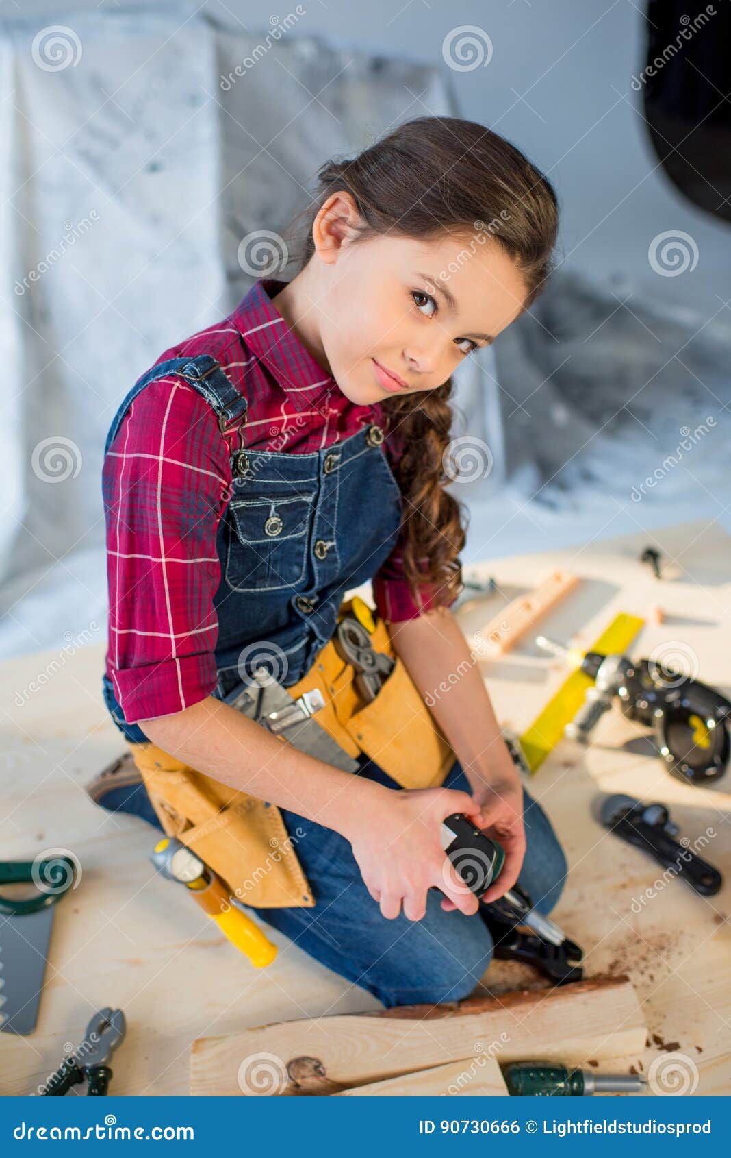 Little girl in workshop stock photo. Image of contractor - 90730666