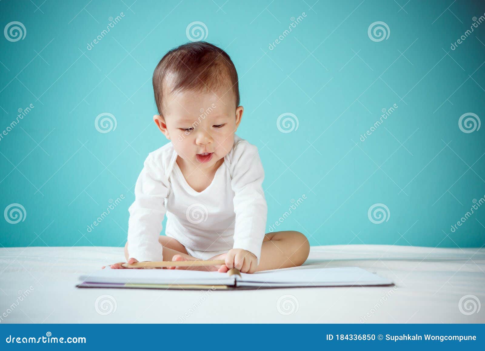 Little Girl Writing in Her Book Stock Photo - Image of beautiful ...