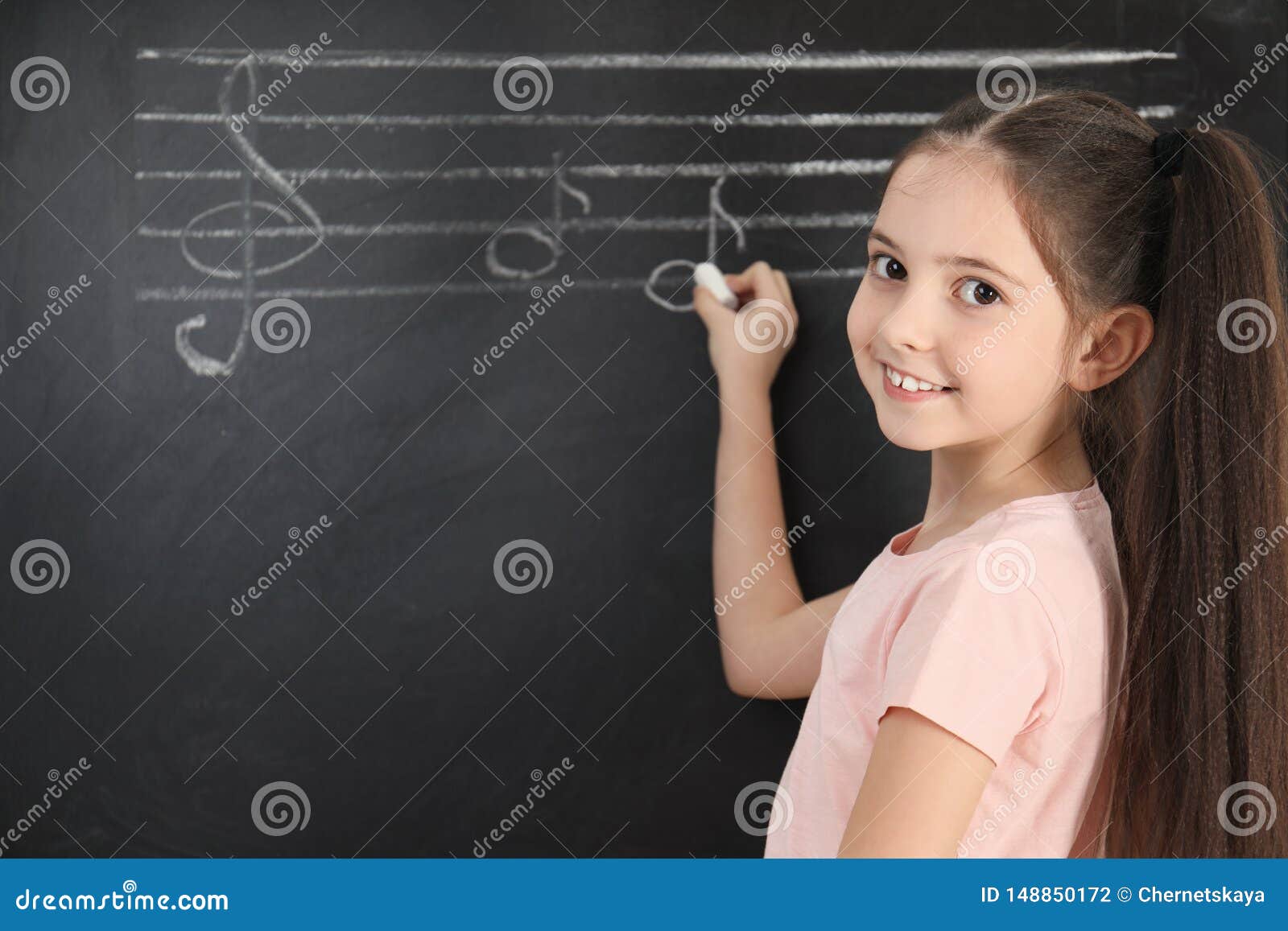 Little Girl Writing Music Notes on Blackboard Stock Photo - Image of ...