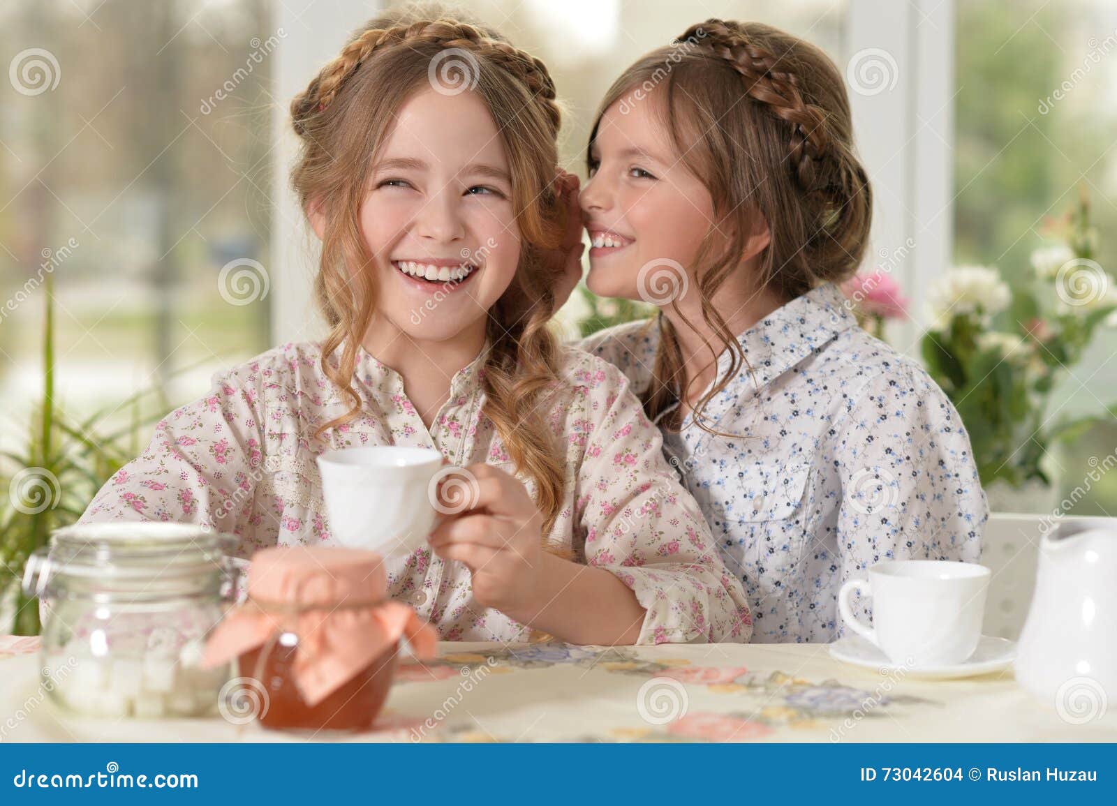 Little girls drinking tea stock photo. Image of family - 73042604