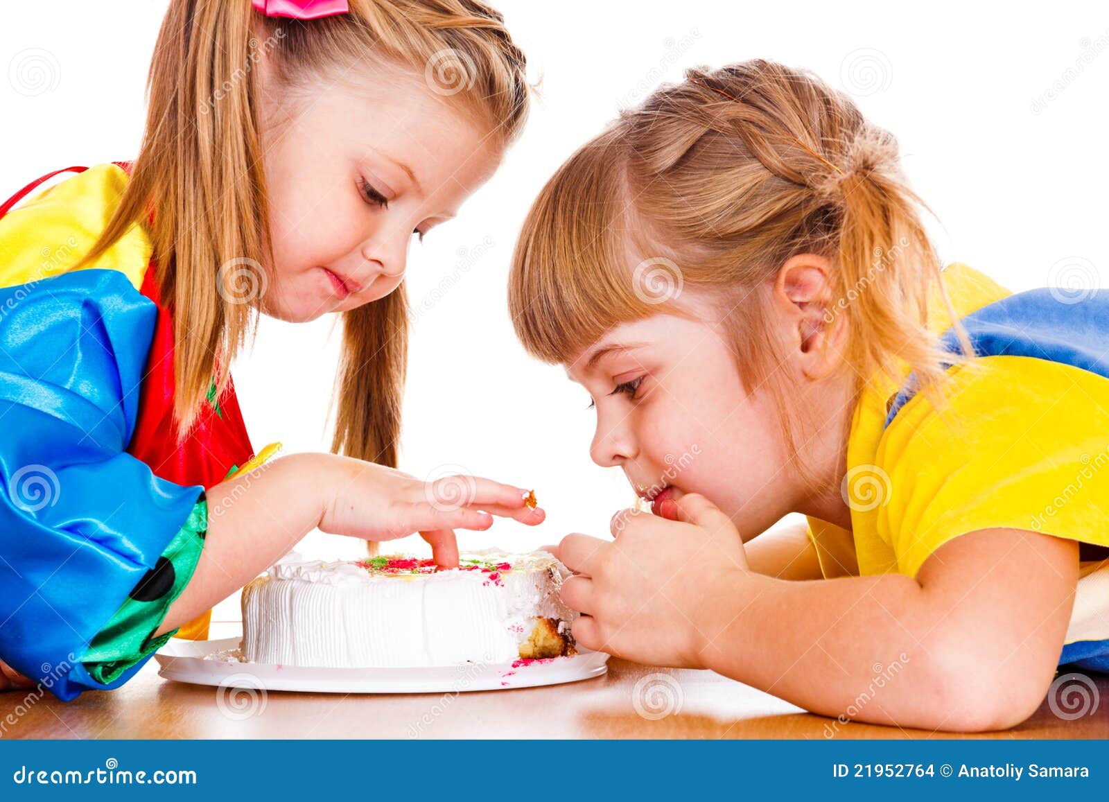 Little girls eating cake stock photo. Image of playful - 21952764