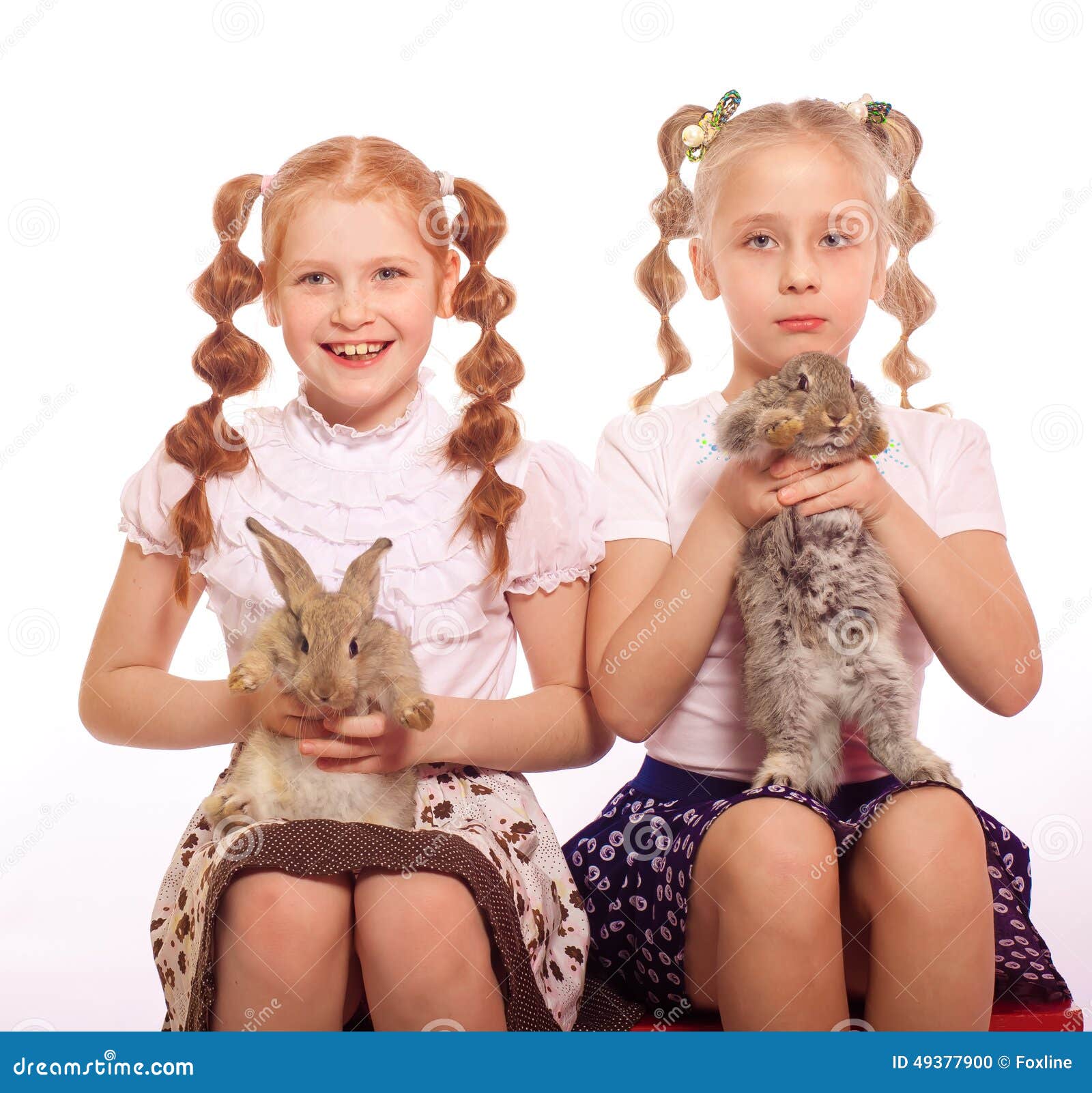 Little Girls with Rabbits in Hands Stock Photo - Image of child ...