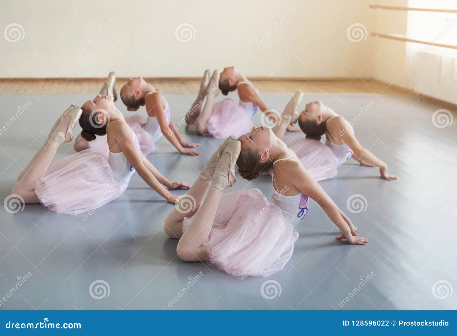 Little Girls Stretching Together in Ballet Class Stock Photo - Image of ...