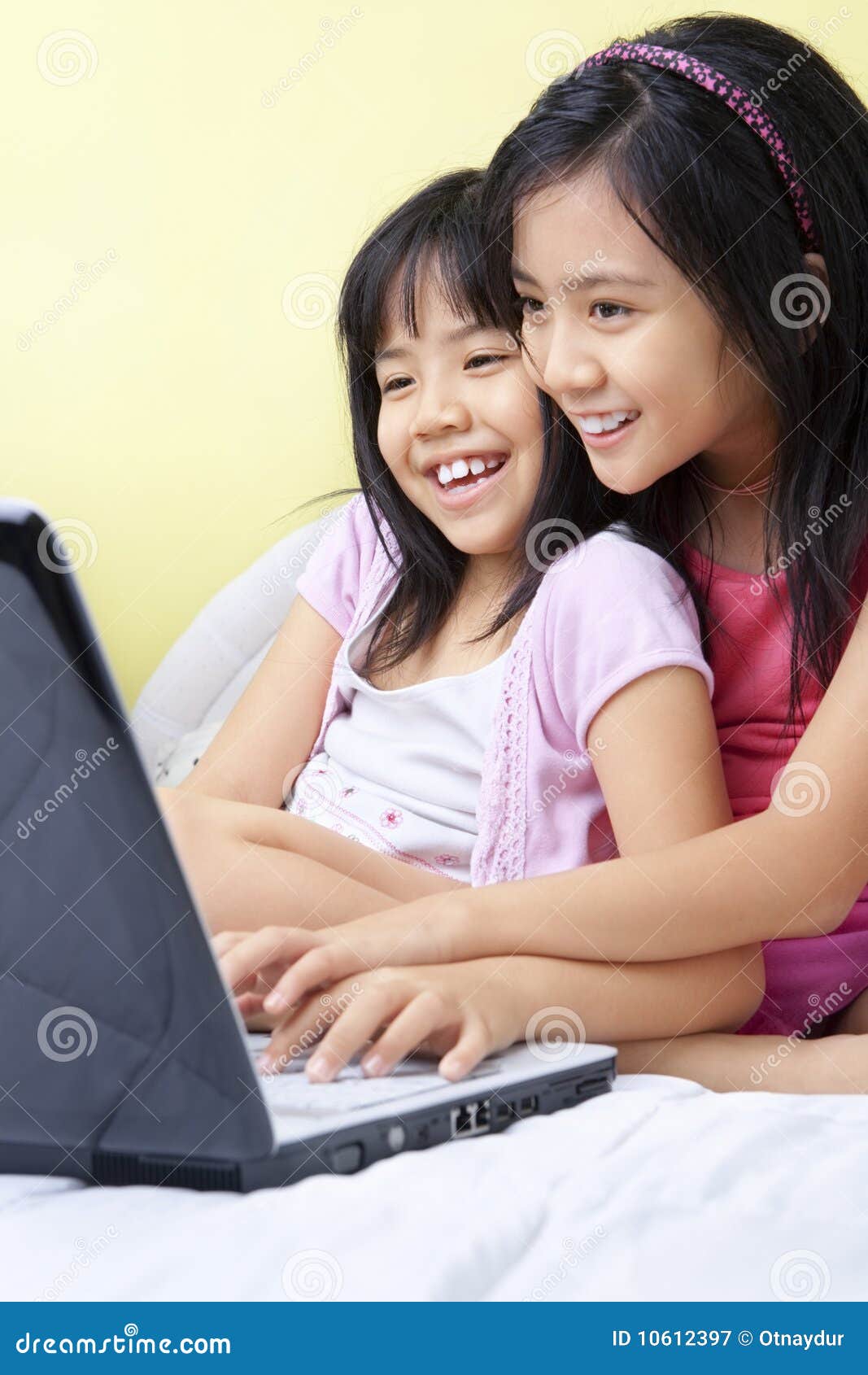 Little girls using laptop stock image. Image of technology - 10612397