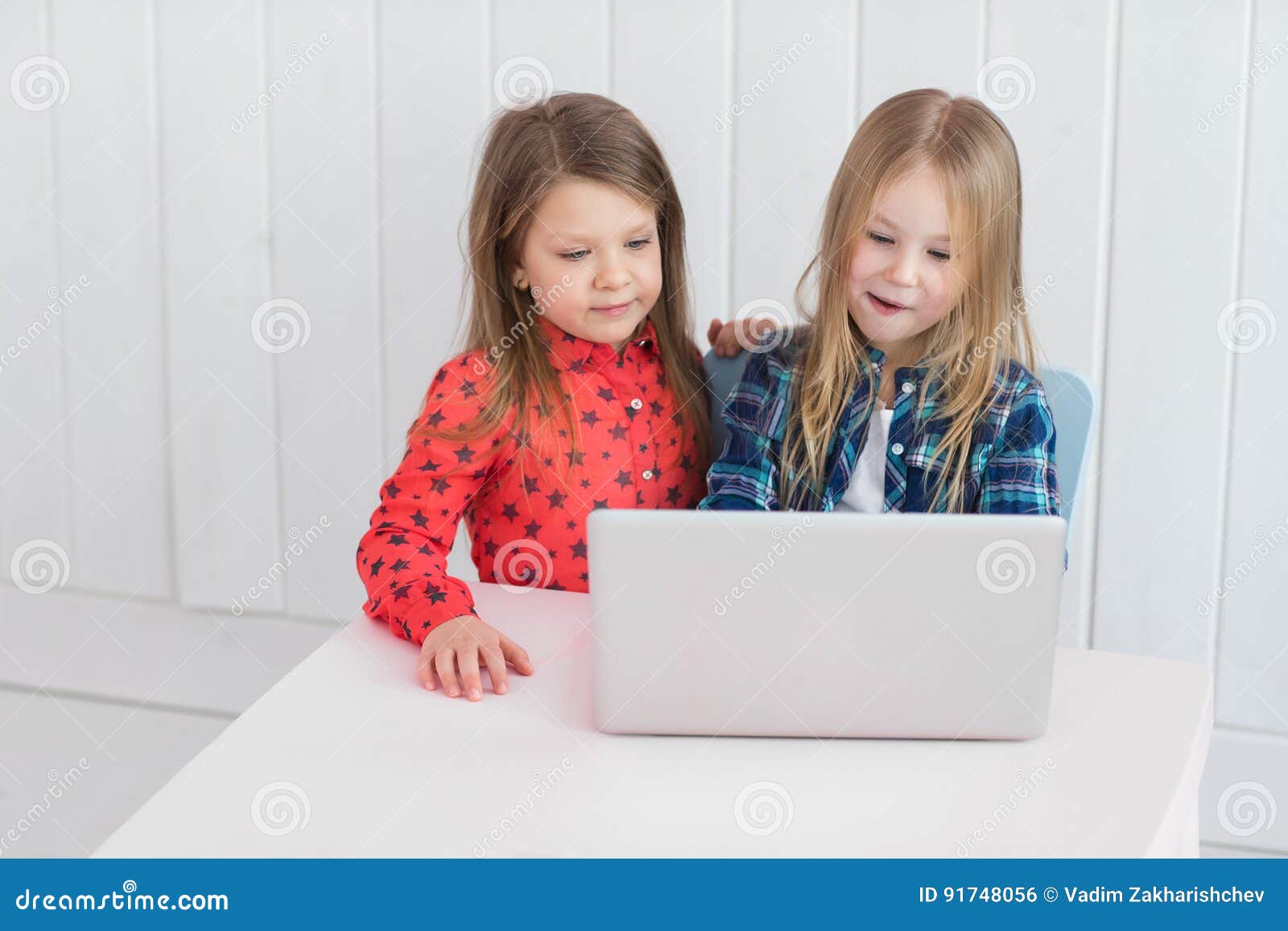 Little Girls are Using Laptop on the Table at Room Stock Photo - Image ...