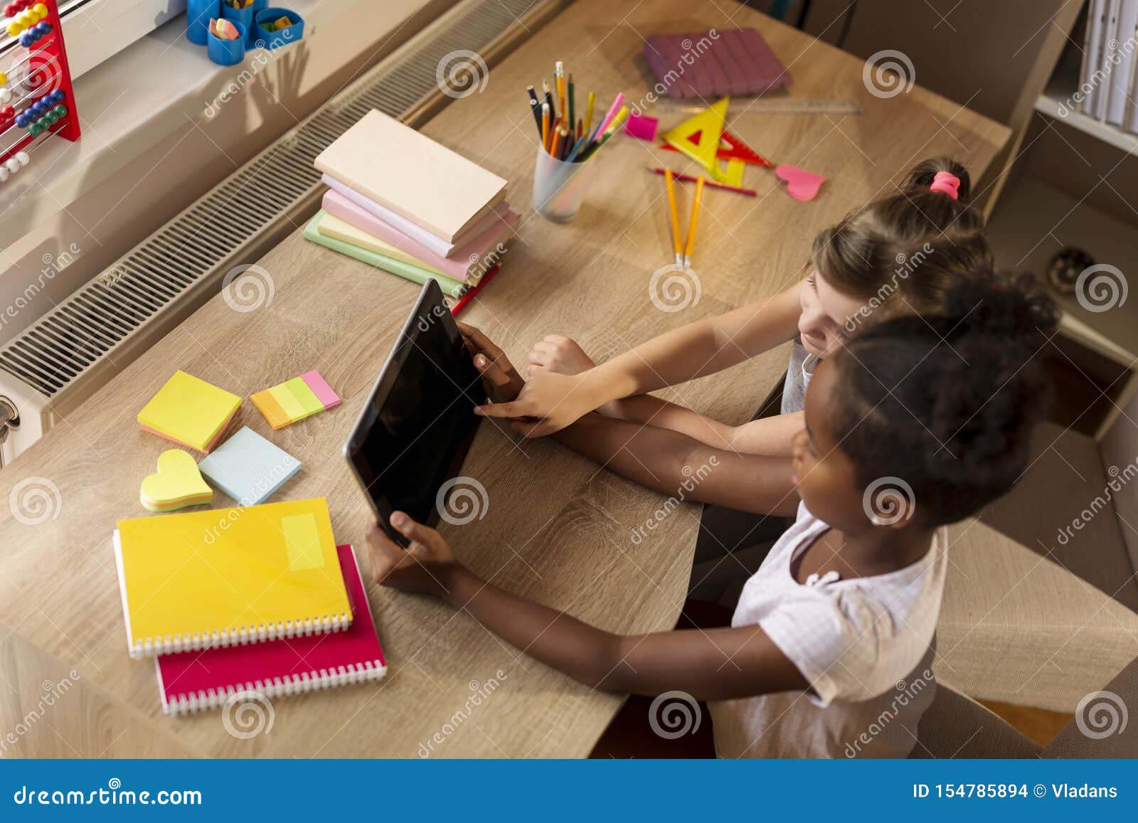 Little Girls Using Tablet Computer Stock Photo - Image of elementary ...