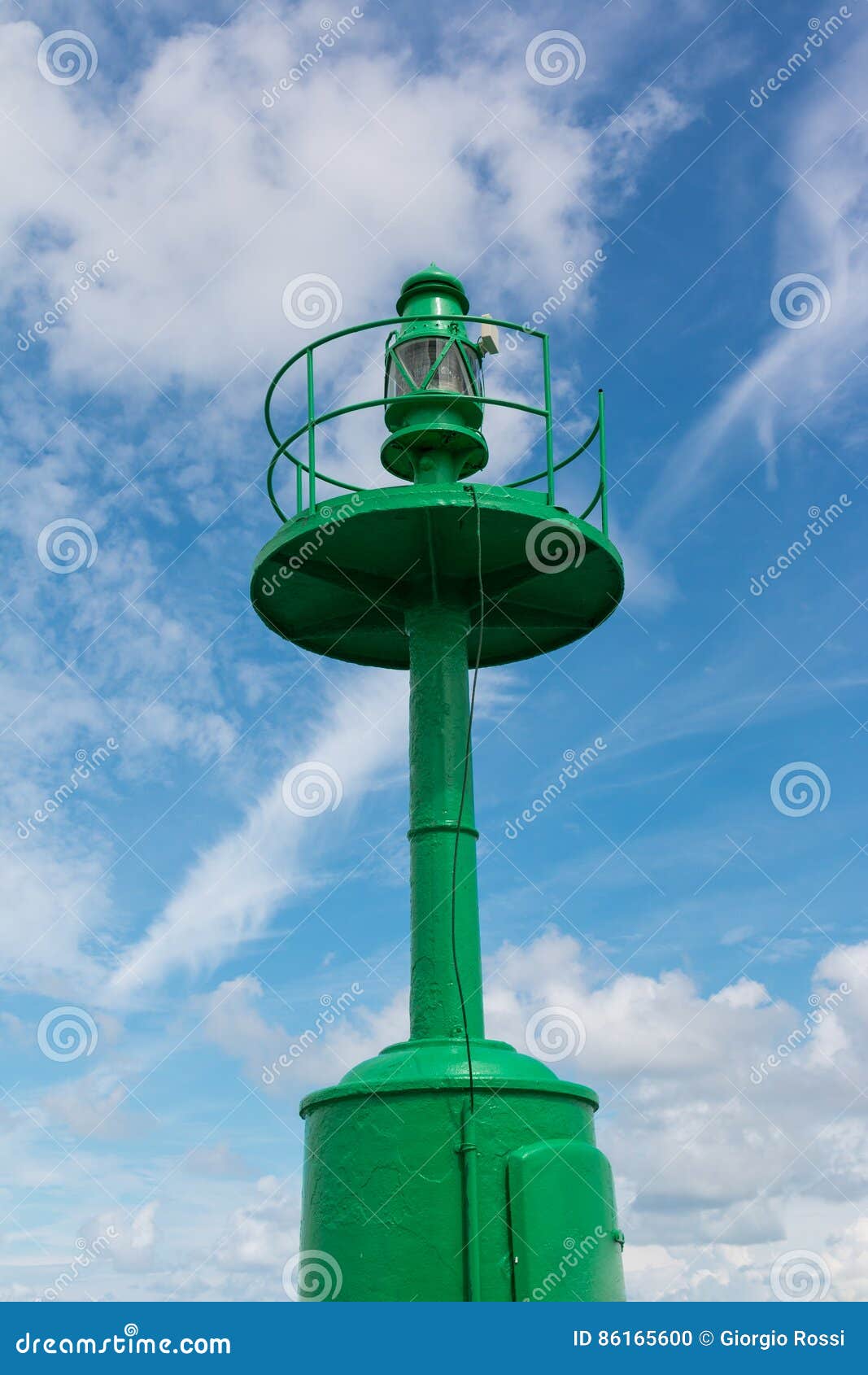 Little Green Metallic Lighthouse, Blue Sky and Clouds in Background ...