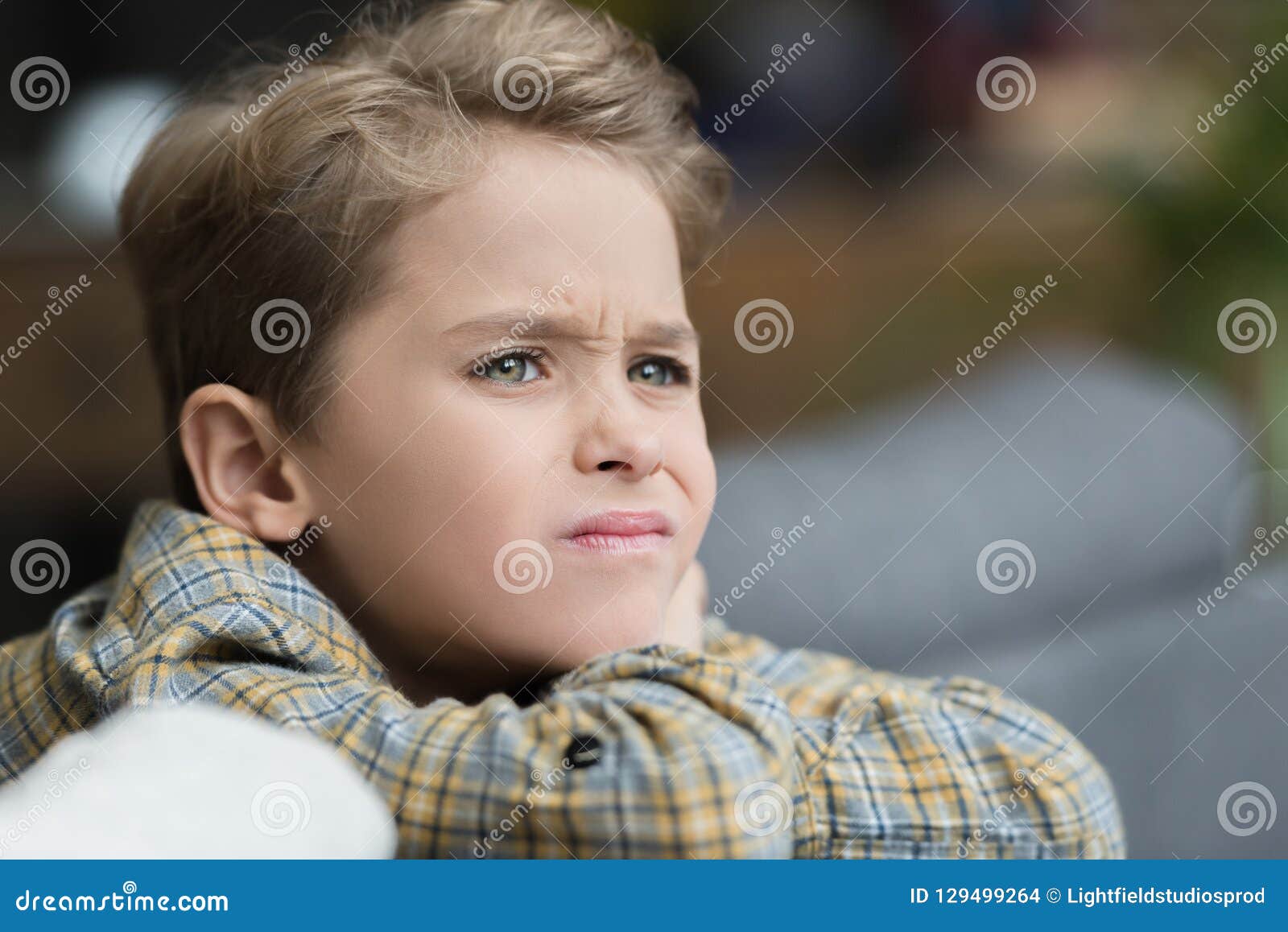 Portrait of Little Boy Making a Grumpy Face while Stock Photo - Image ...