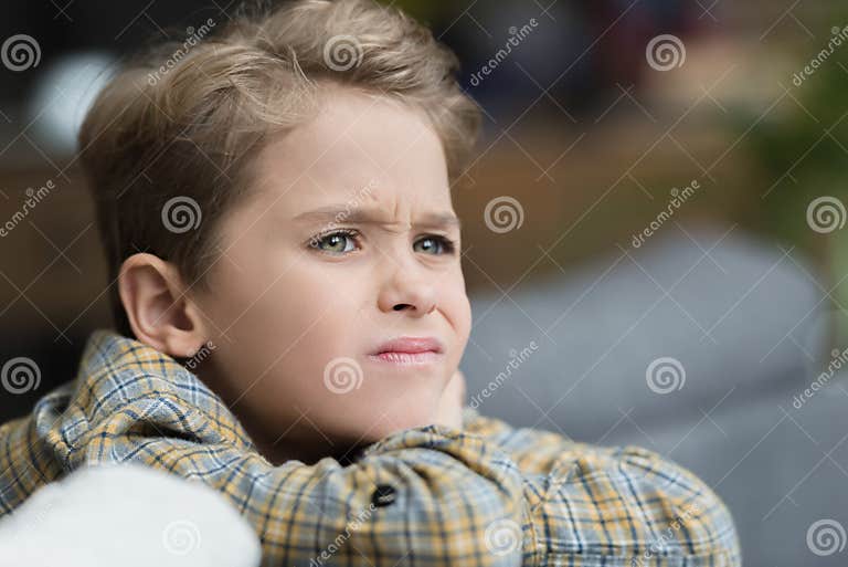 Portrait of Little Boy Making a Grumpy Face while Stock Photo - Image ...