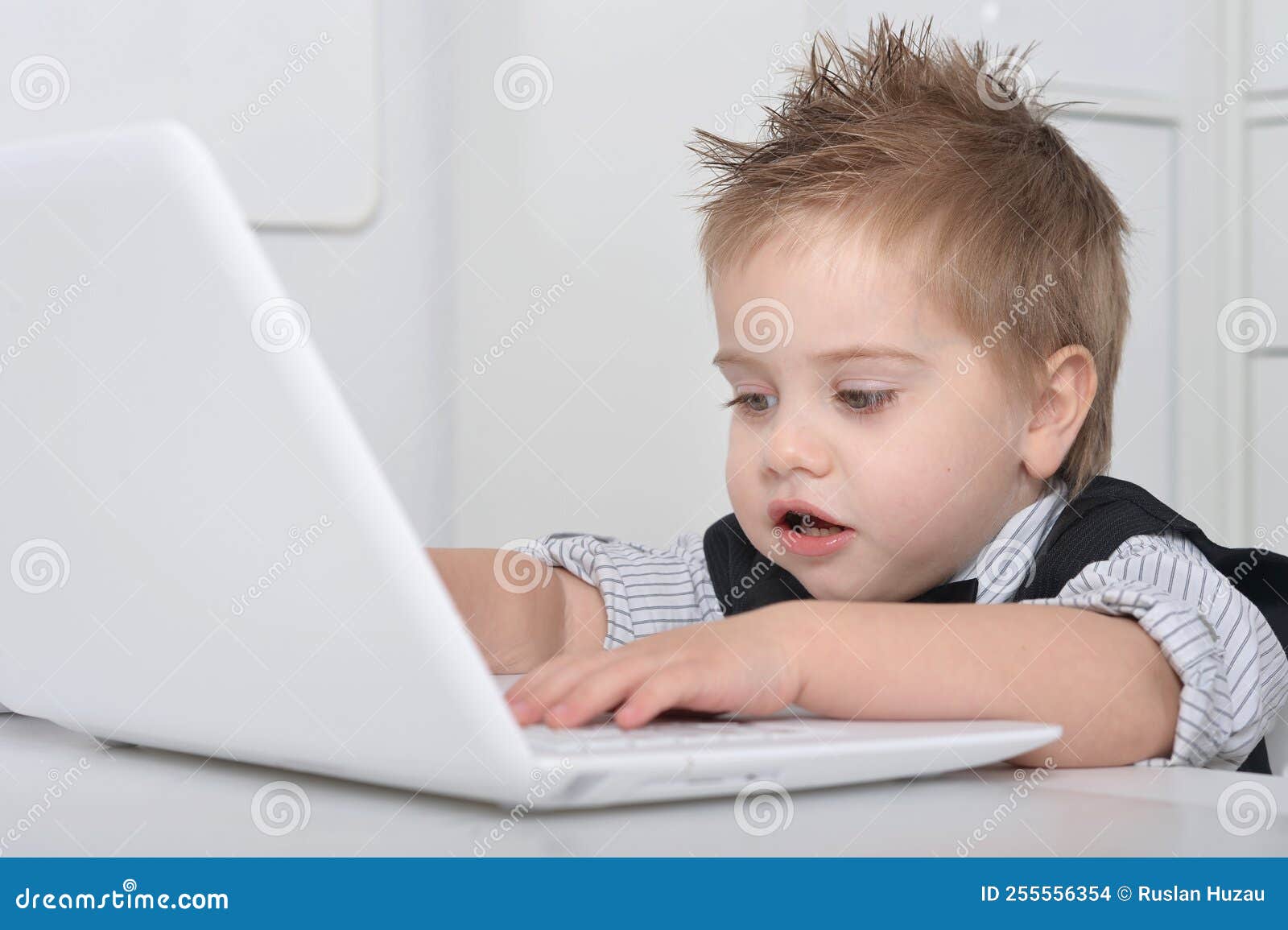 Little Handsome Boy Sits with a Computer Stock Photo - Image of game ...