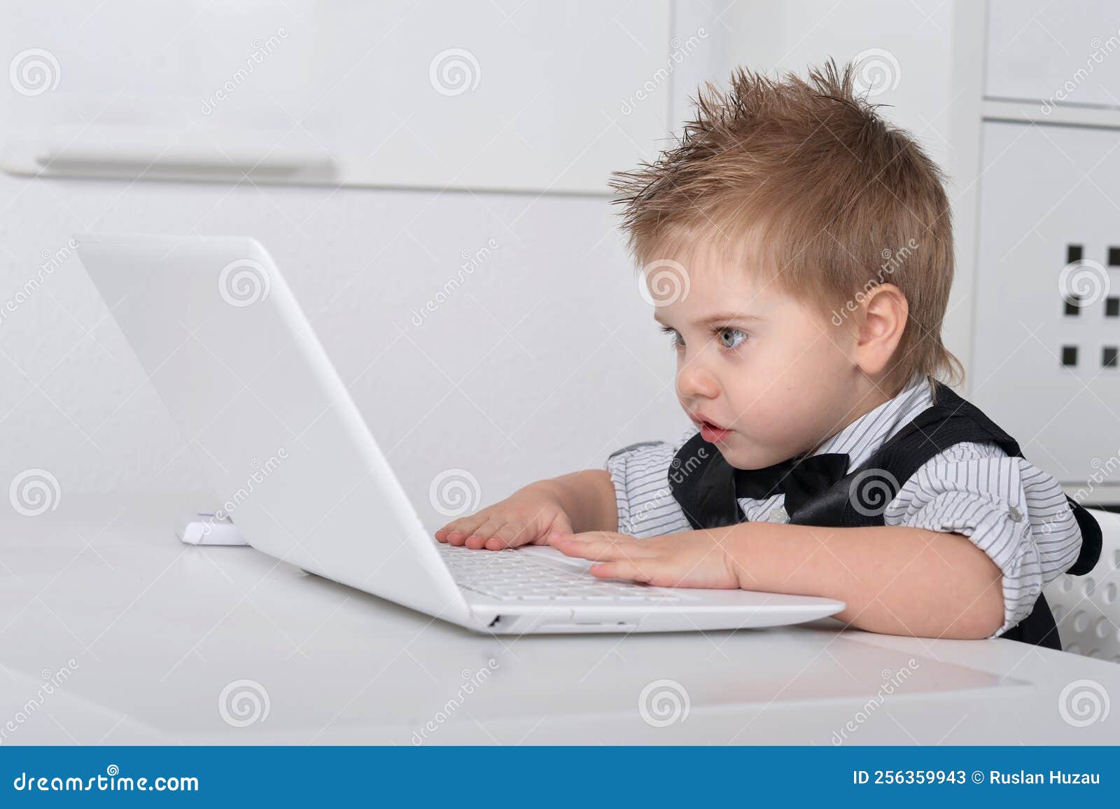 Little Handsome Boy Sits with a Computer Stock Image - Image of face ...
