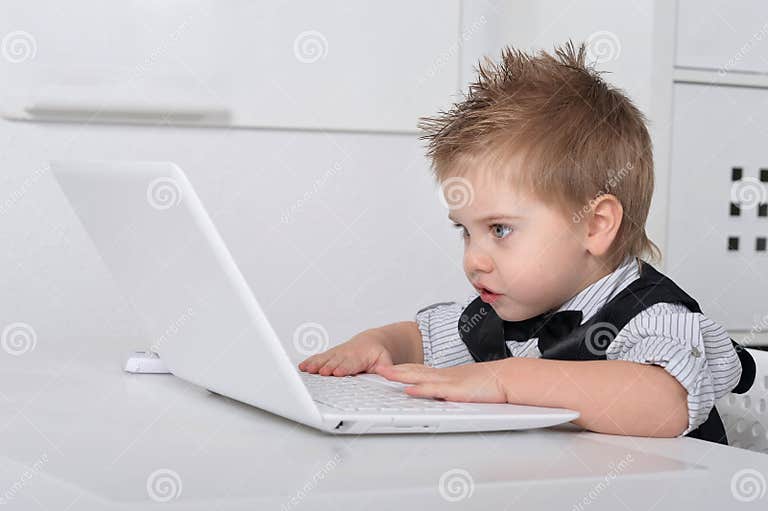Little Handsome Boy Sits with a Computer Stock Image - Image of face ...