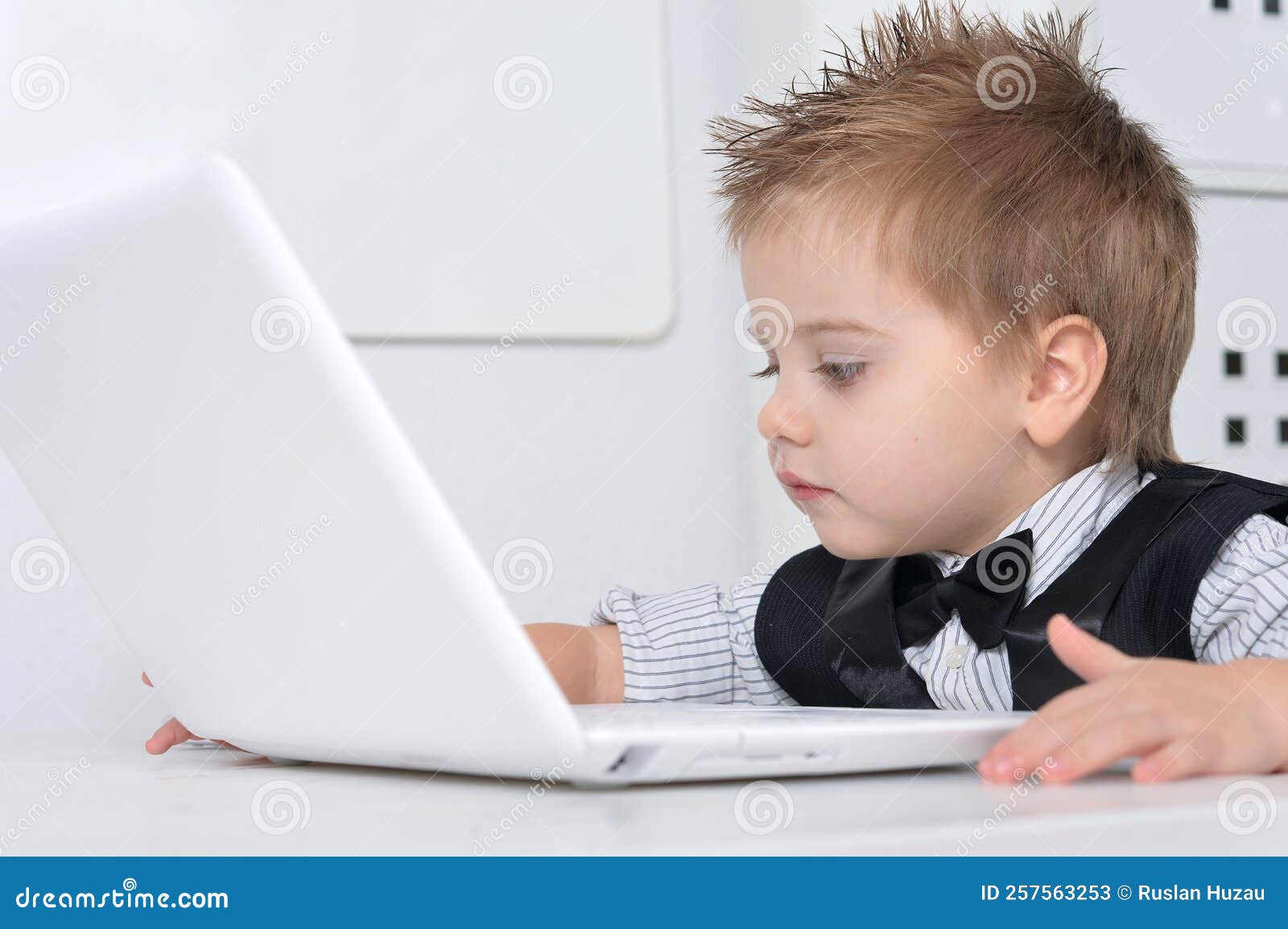 Little Handsome Boy Sits with a Computer Stock Image - Image of young ...