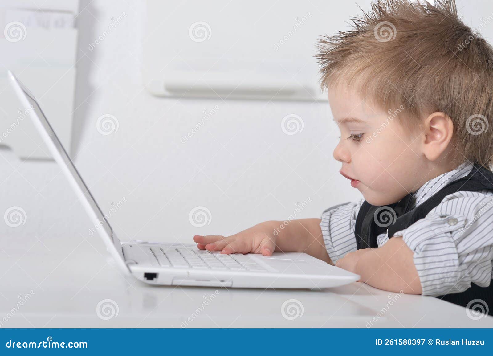 Little Handsome Boy Sits with a Computer Stock Image - Image of ...