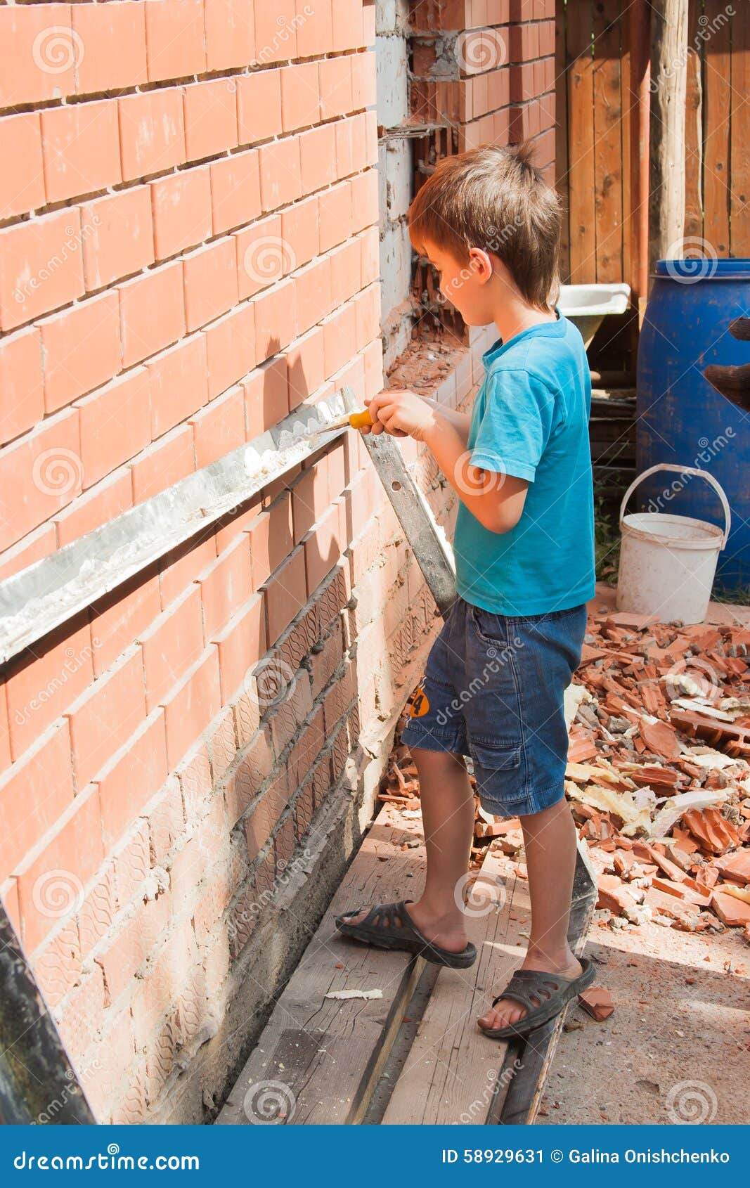 Little helper, boy at work stock image. Image of little - 58929631