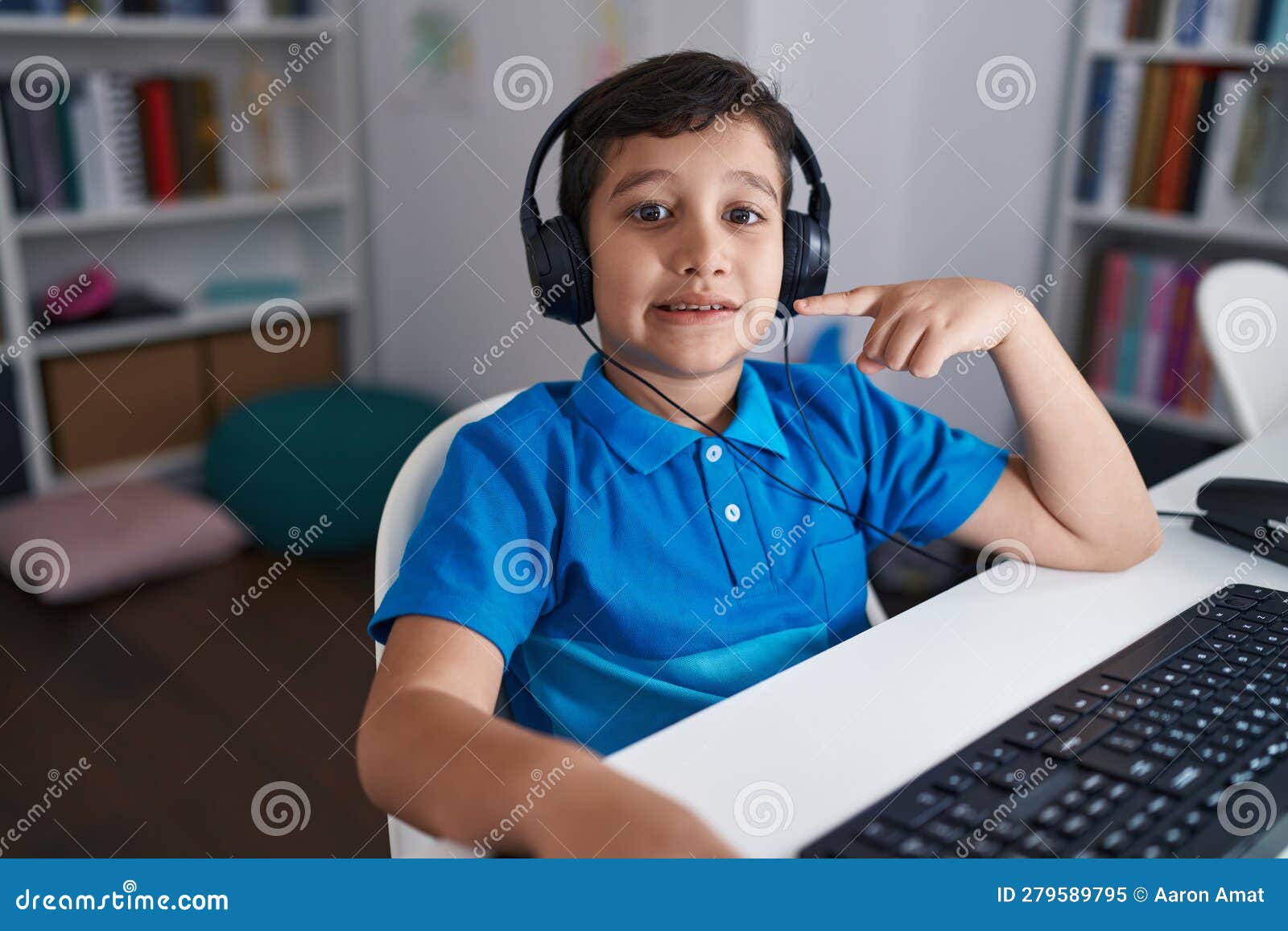 Little Hispanic Boy Using Computer Laptop at the School Smiling Happy ...