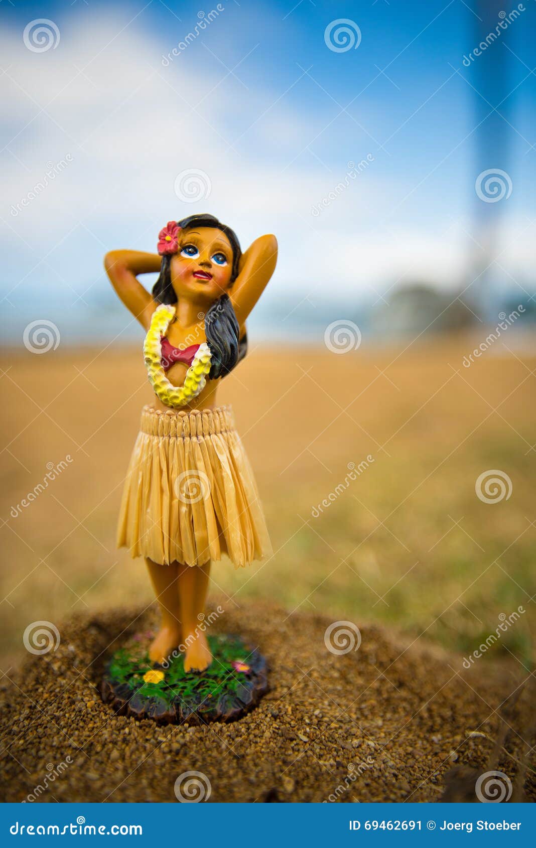 Little Hula Dancer Figure in the Sand Stock Image - Image of hawaiian ...