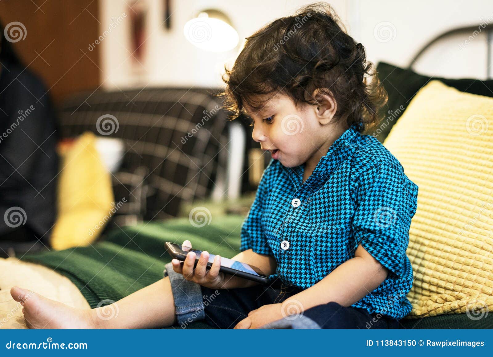 Little Indian Boy Using Mobile Phone Stock Photo - Image of child ...
