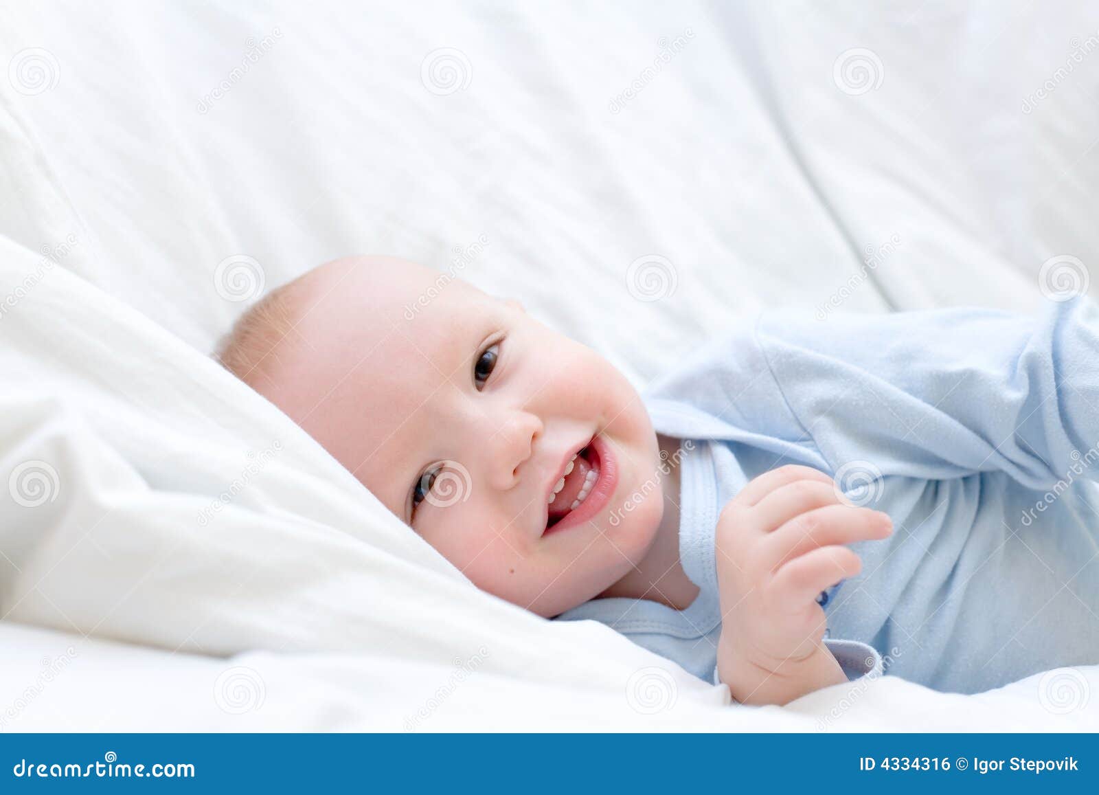 Little Joyful Baby Resting on Bed Stock Photo - Image of face ...