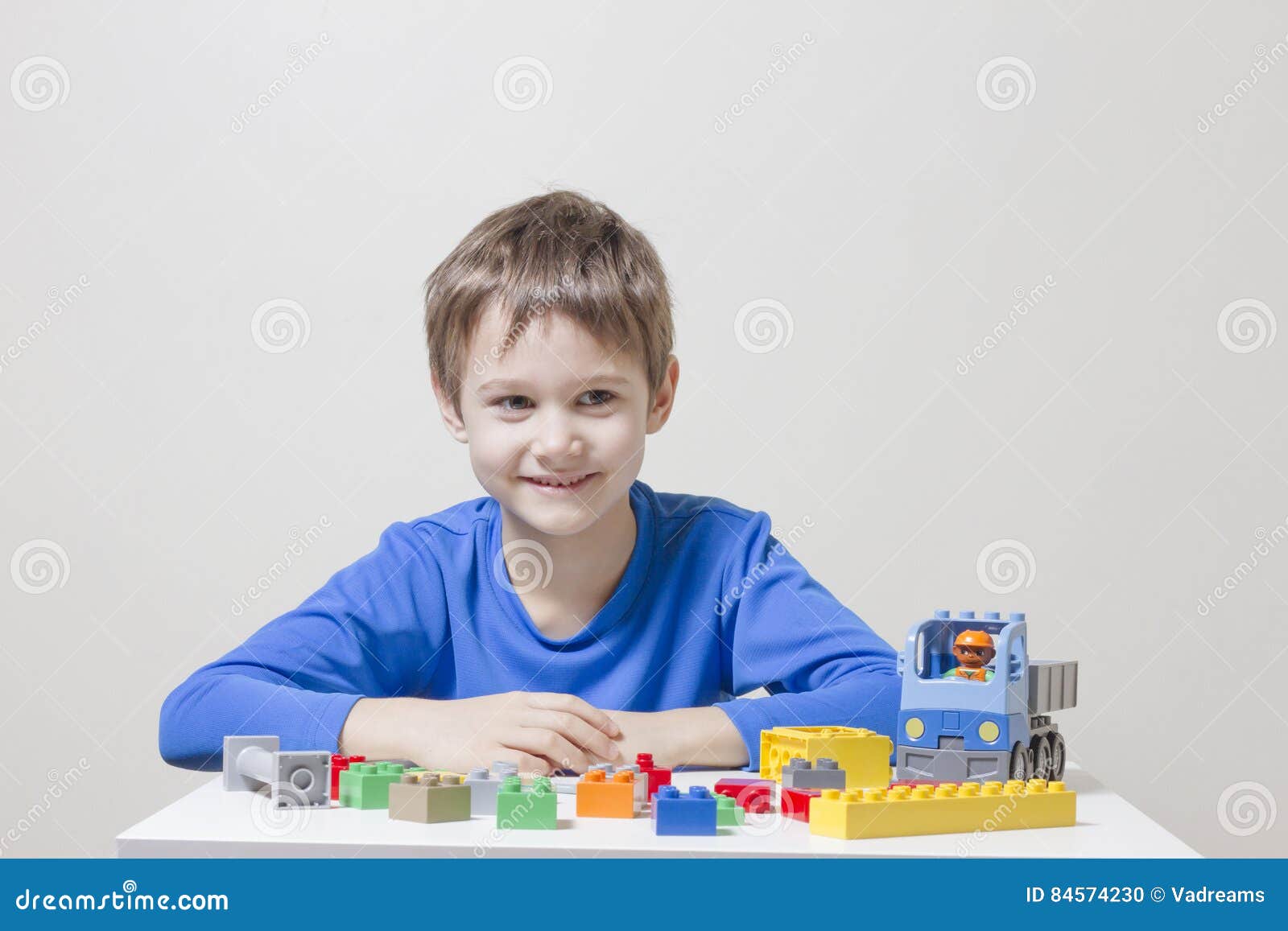 Little Kid Boy Playing with Colorful Plastic Construction Bricks at ...