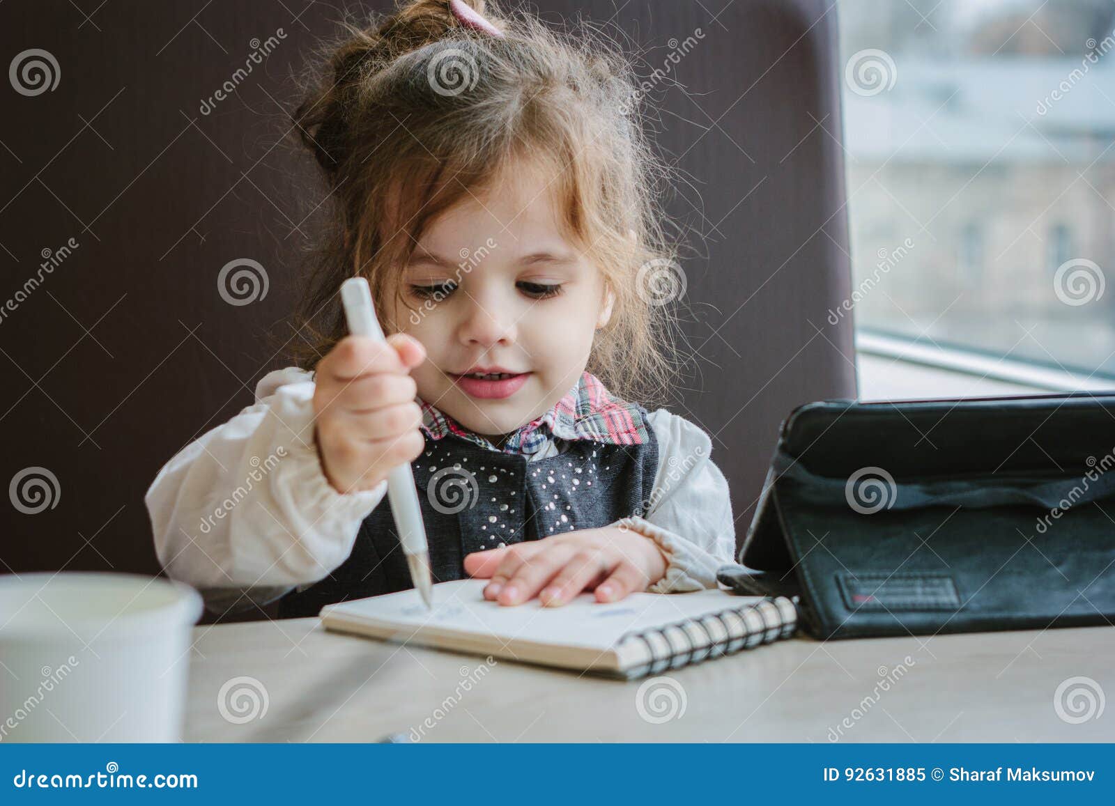 Little Kid Girl Writing or Drawing with Pen in Scetch Book Stock Image ...
