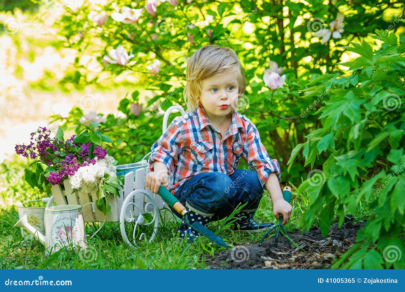Little Kid Helping in the Garden Stock Image - Image of green, outdoors ...