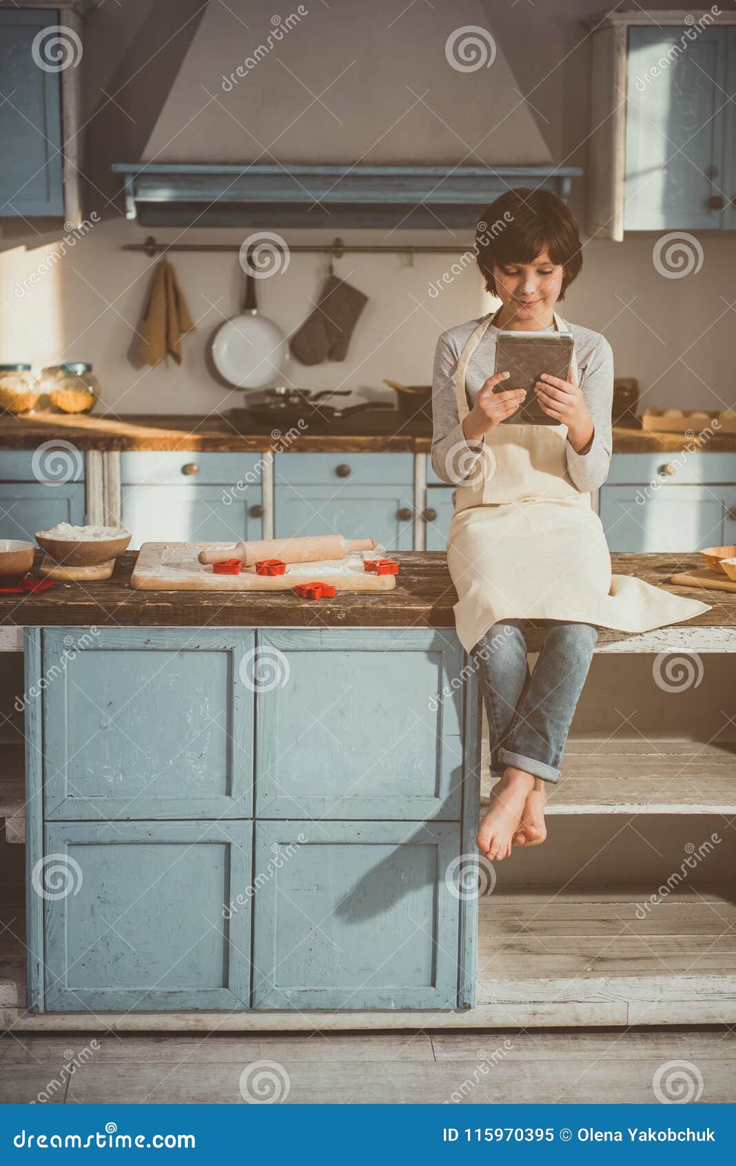 Boy Distracted by Gadgets during Cooking Stock Image - Image of child ...