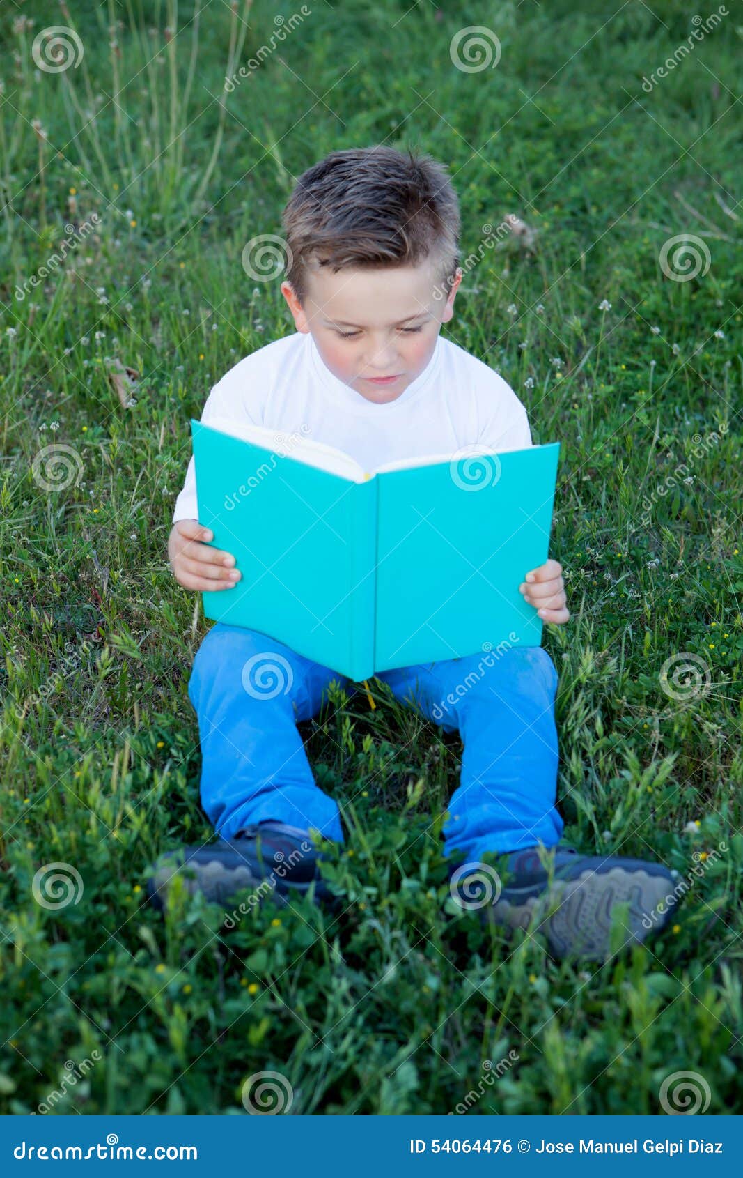 Little Kid Reading a Book at Outside Stock Photo - Image of park, child ...