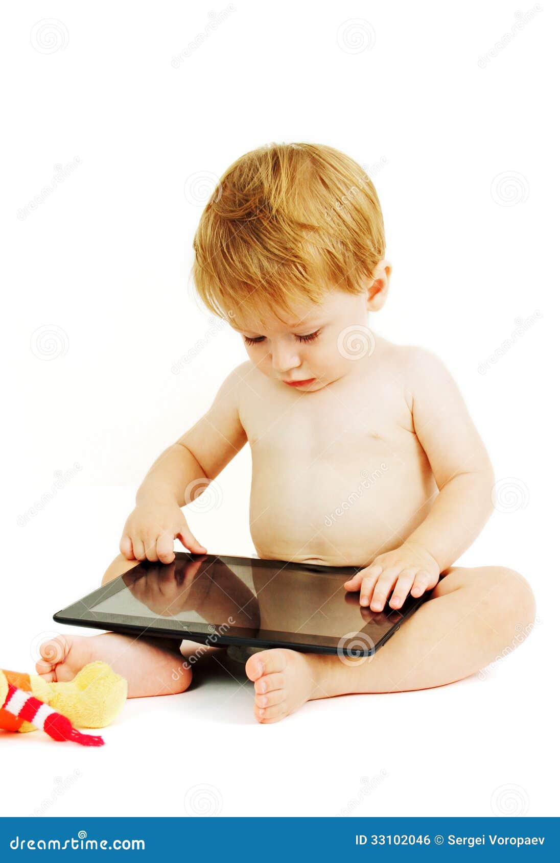 Little kid on the tablet. stock photo. Image of playing - 33102046