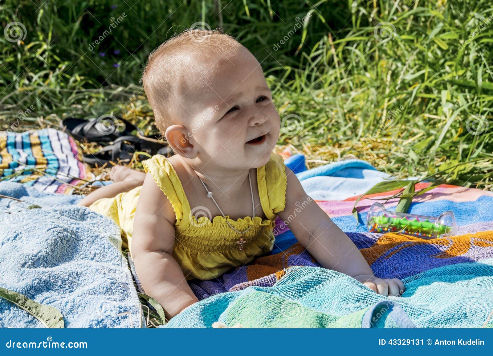 Little Kid Tans in the Sun Outdoors on a Summer Day Stock Image - Image ...