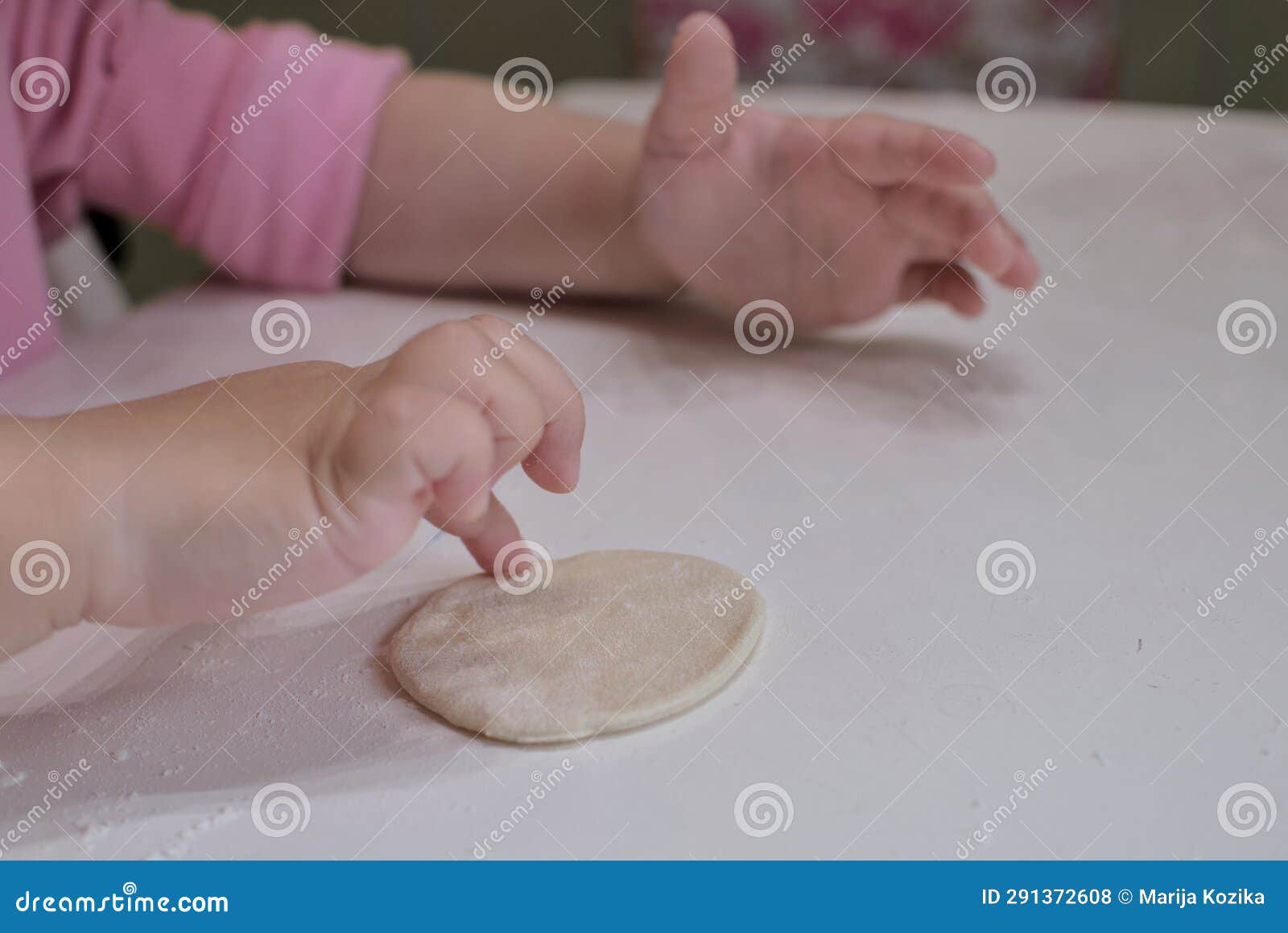 Little Kids Hands Touching a Round Piece of Dough in Process of ...
