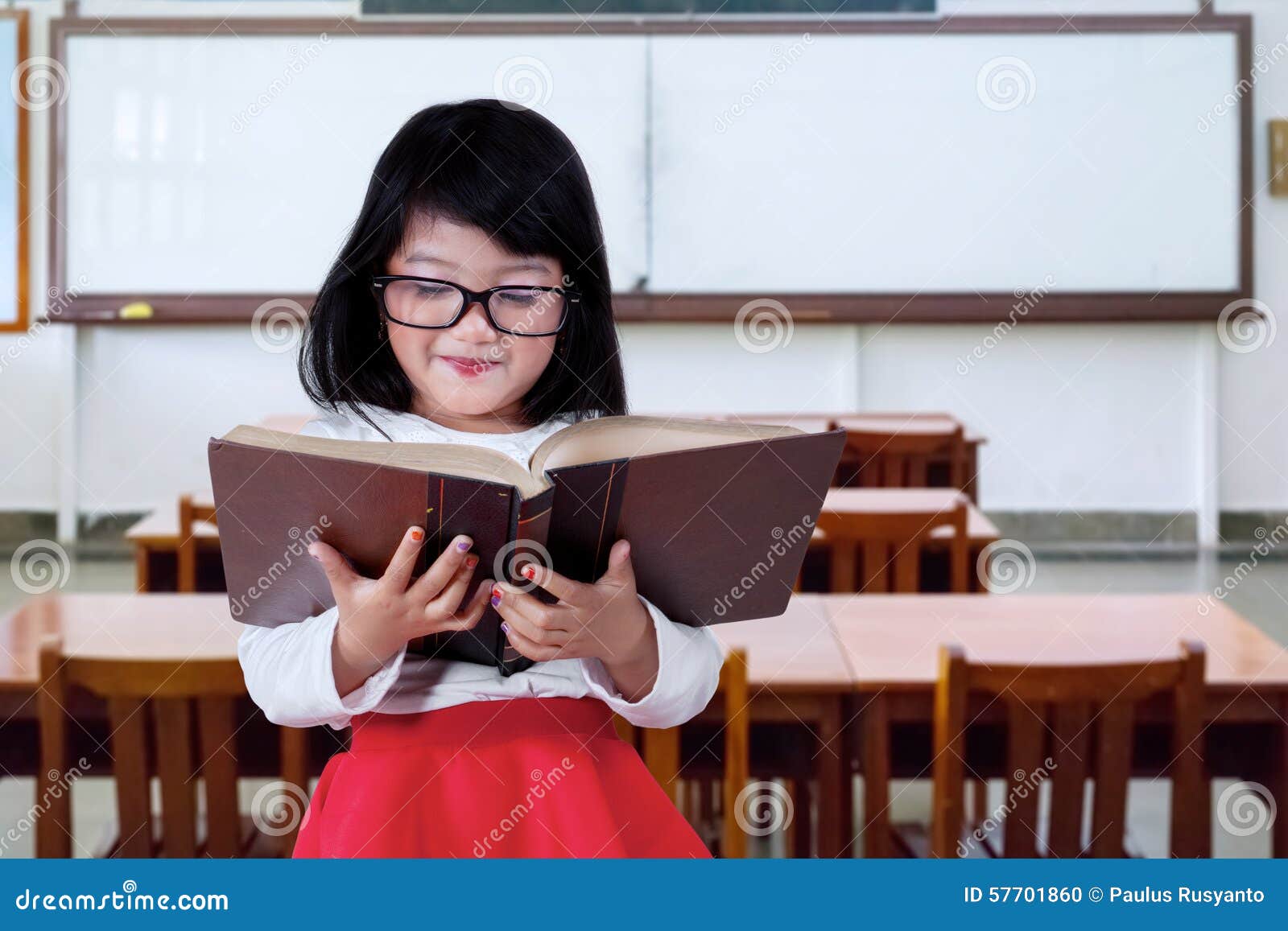 Little Learner Reading a Book in Class Stock Photo - Image of little ...
