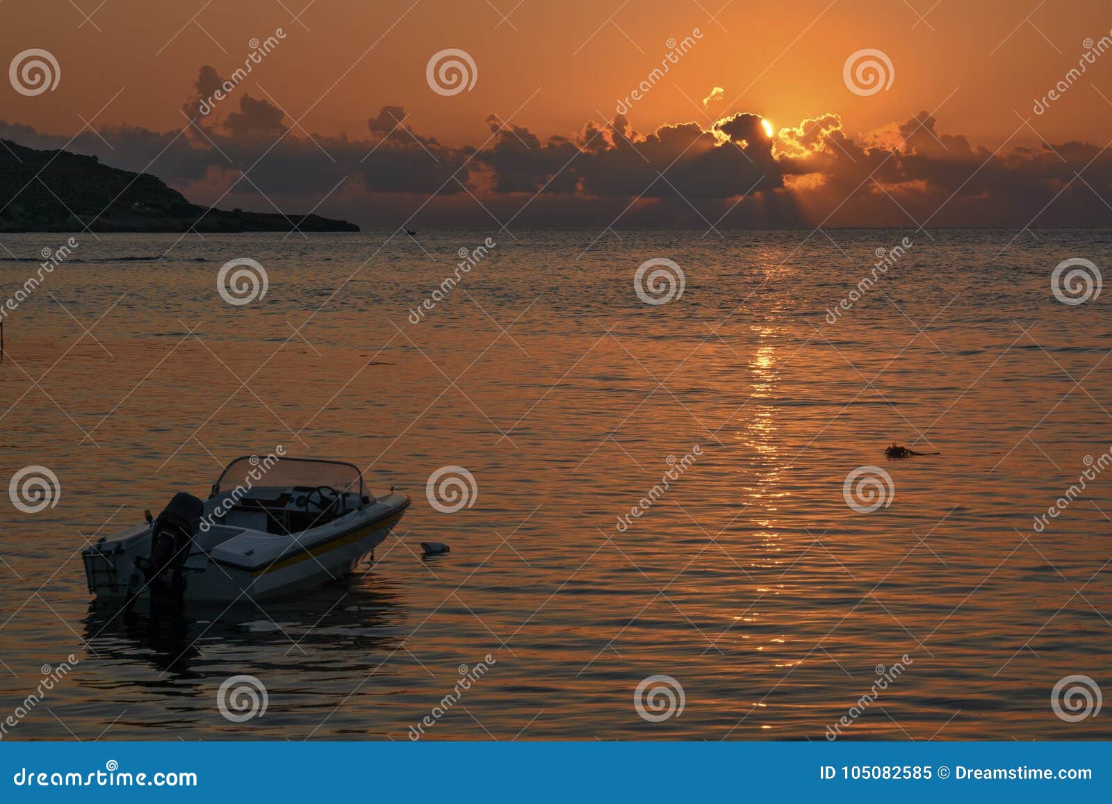 The motor boat at sunset stock image. Image of sunset - 105082585