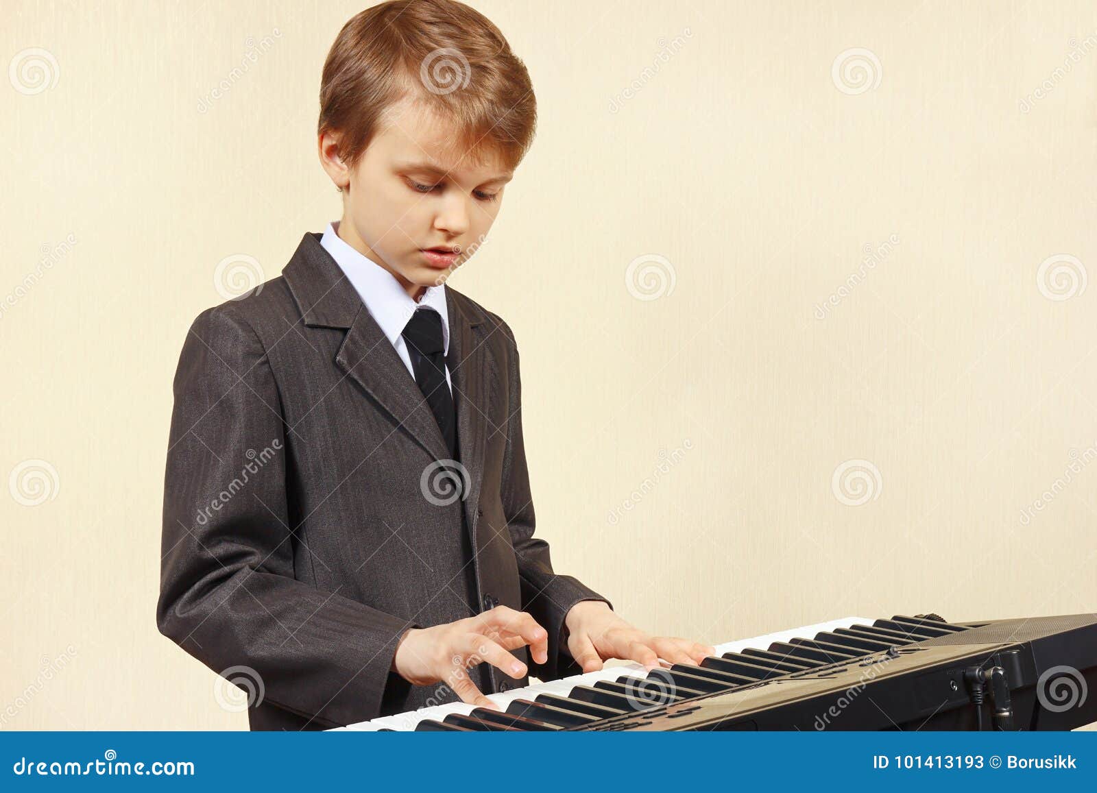 Little Musician in Suit Playing the Electronic Synthesizer Stock Image ...
