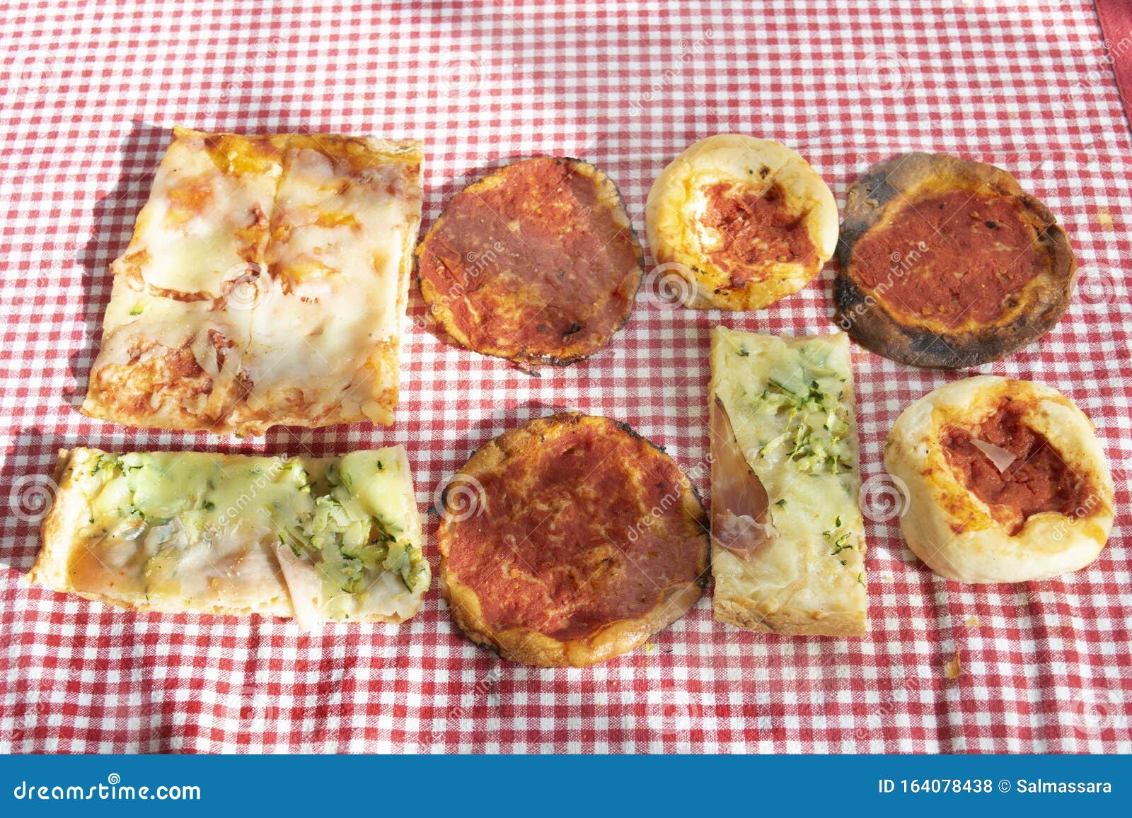 Little Pizzas and Variety of Pizza by the Slice Stock Photo - Image of ...