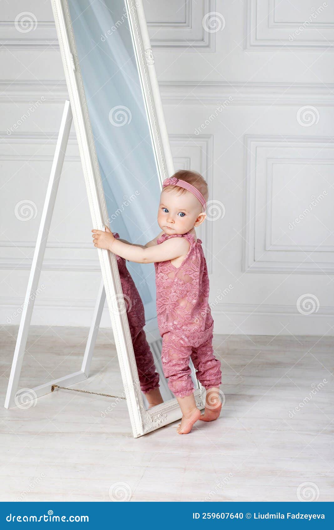 Little Pretty Girl Plays with a Big Mirror Stock Photo - Image of curly ...