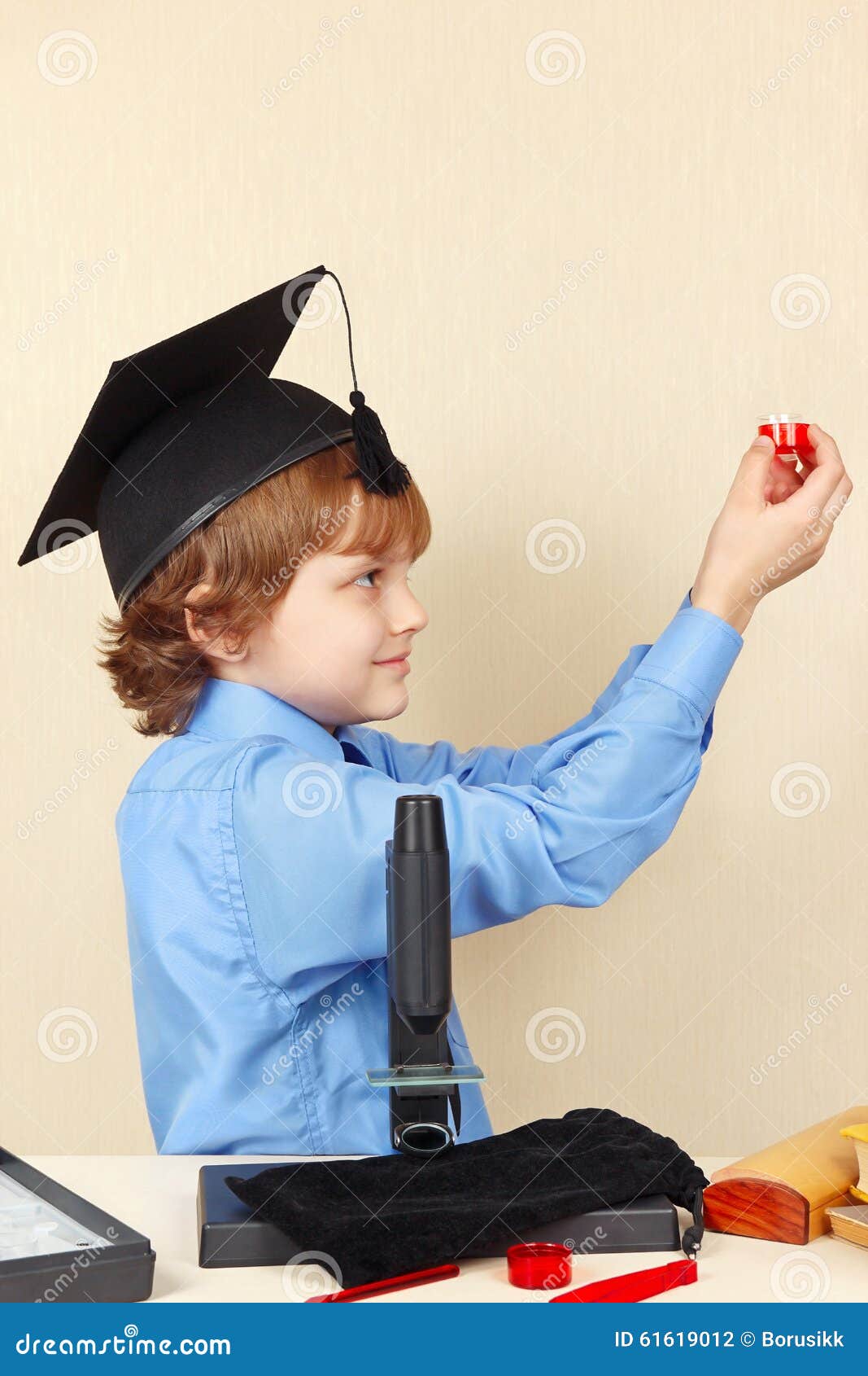 Little Professor in Academic Hat Conducts Scientific Research with ...