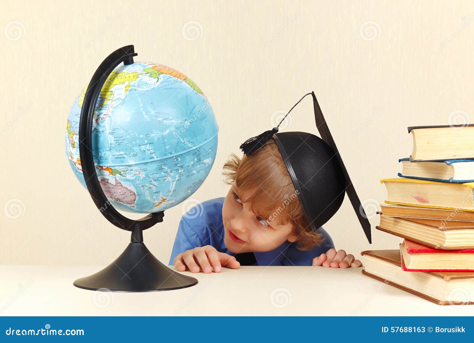 Little Professor in Academic Hat Looks at Geographical Globe Stock ...