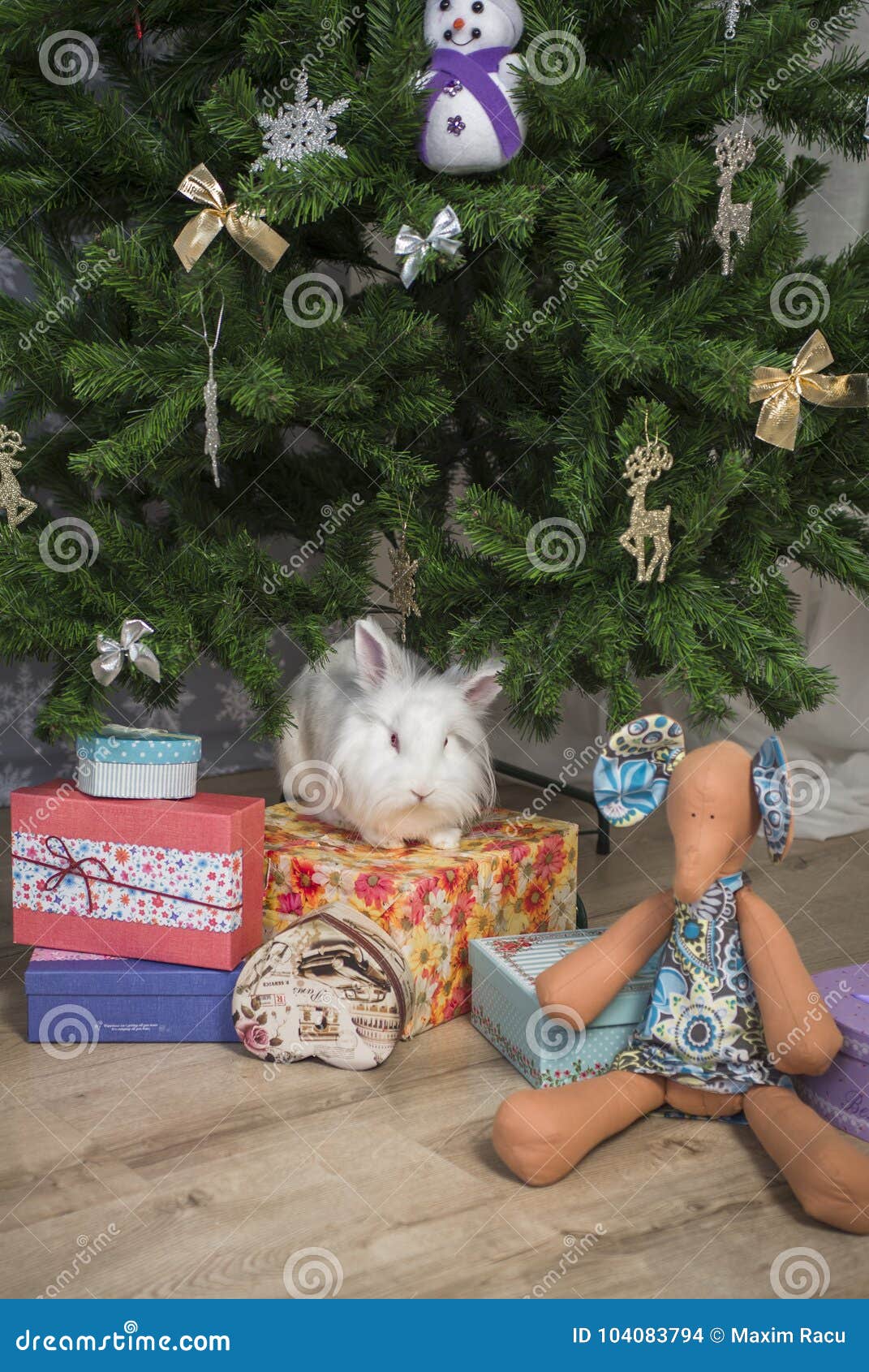 Little Rabbit Sits Under the Christmas Tree Stock Photo - Image of ball ...