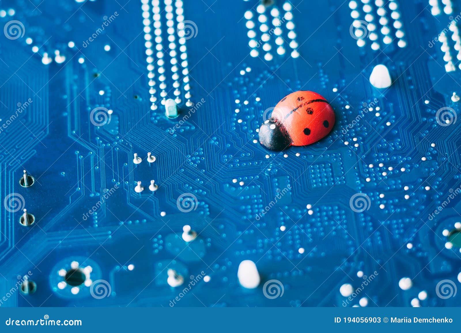 Little Red Ladybug on a Blue Motherboard. Concept of Computer Virus or ...