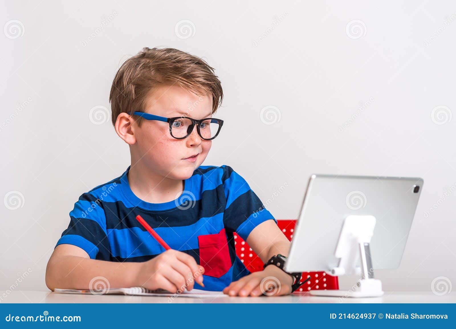 Little School Kid with Glasses Making Homework on Computer. Child ...