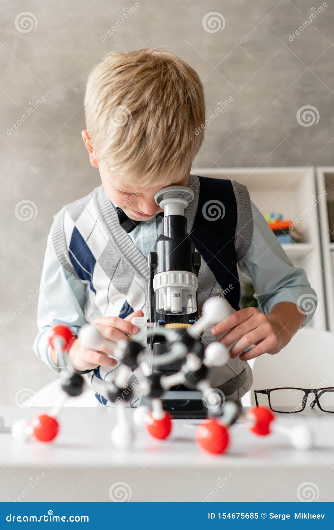 Little Schoolboy in Casual Clothes Looks in Microscope Stock Image ...