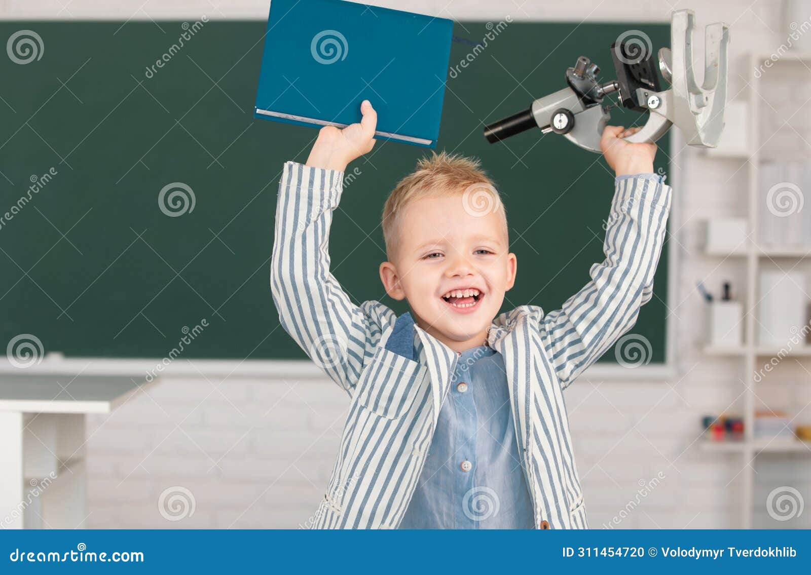 Little Schoolboy Study in a Classroom at Elementary School. Excited ...