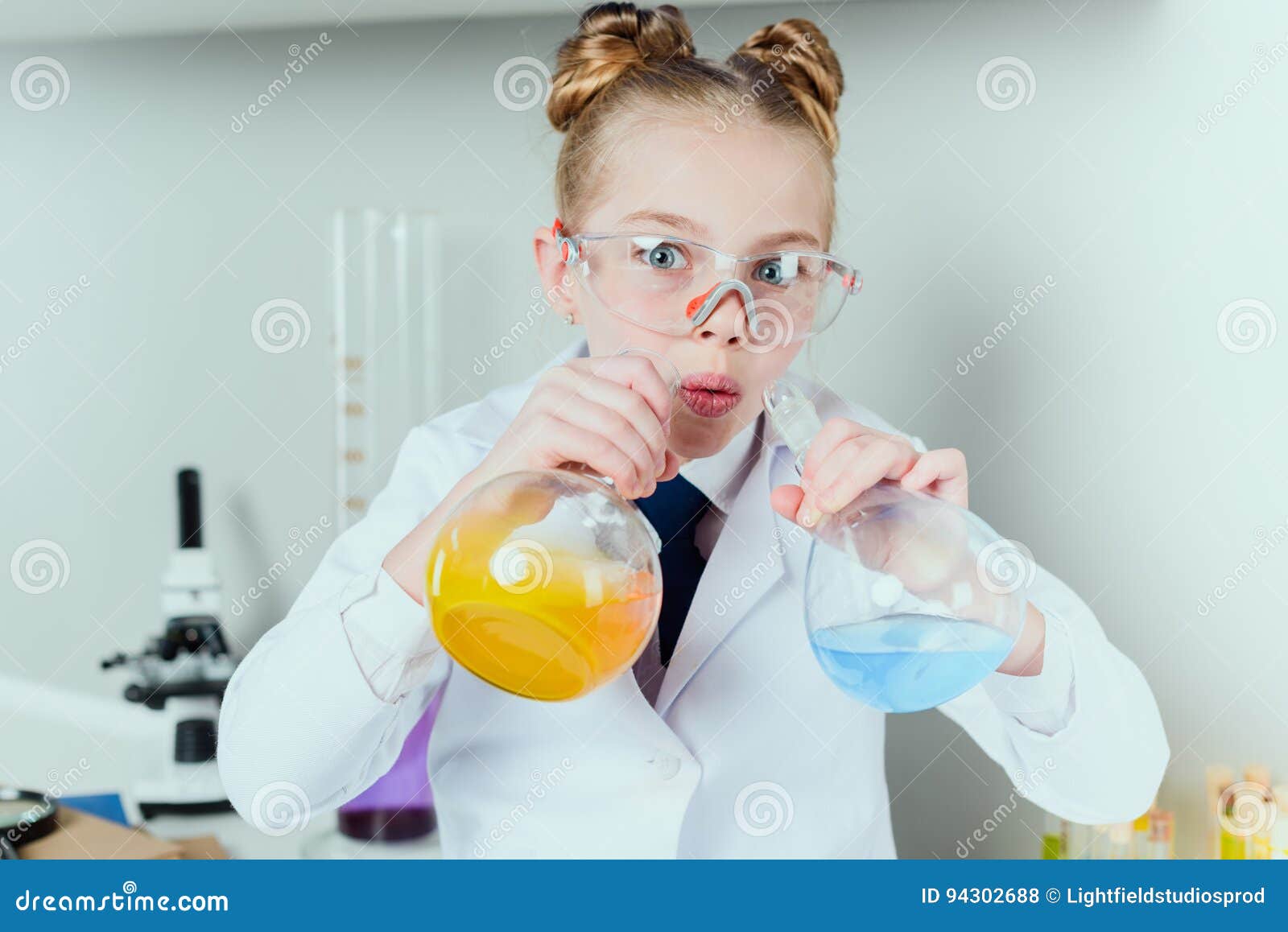 Little Scientist in Lab Coat and Protective Eyeglasses Making ...