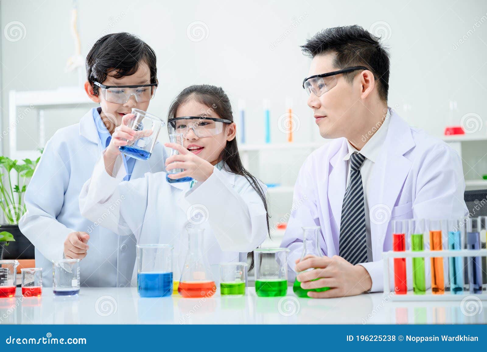 Little Scientists Adding Color Dye into Beakers Stock Photo - Image of ...