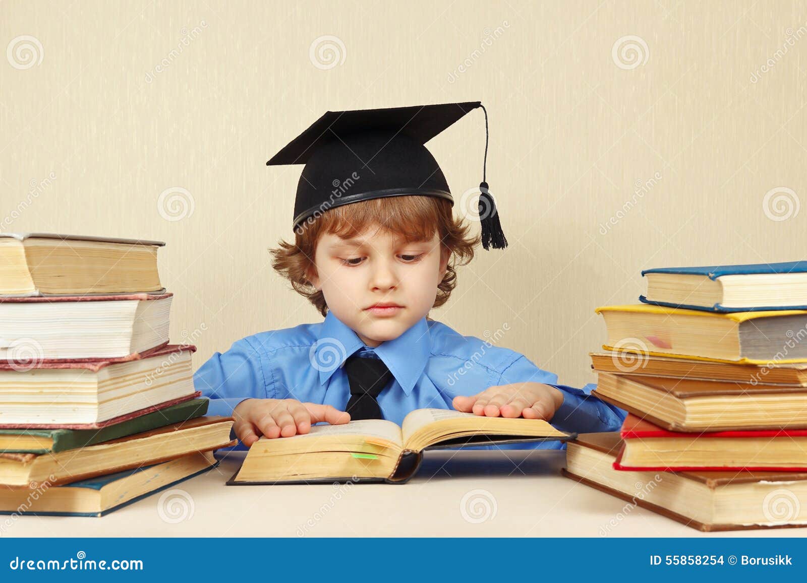 Little Serious Boy in Academic Hat Reading Old Books Stock Photo ...