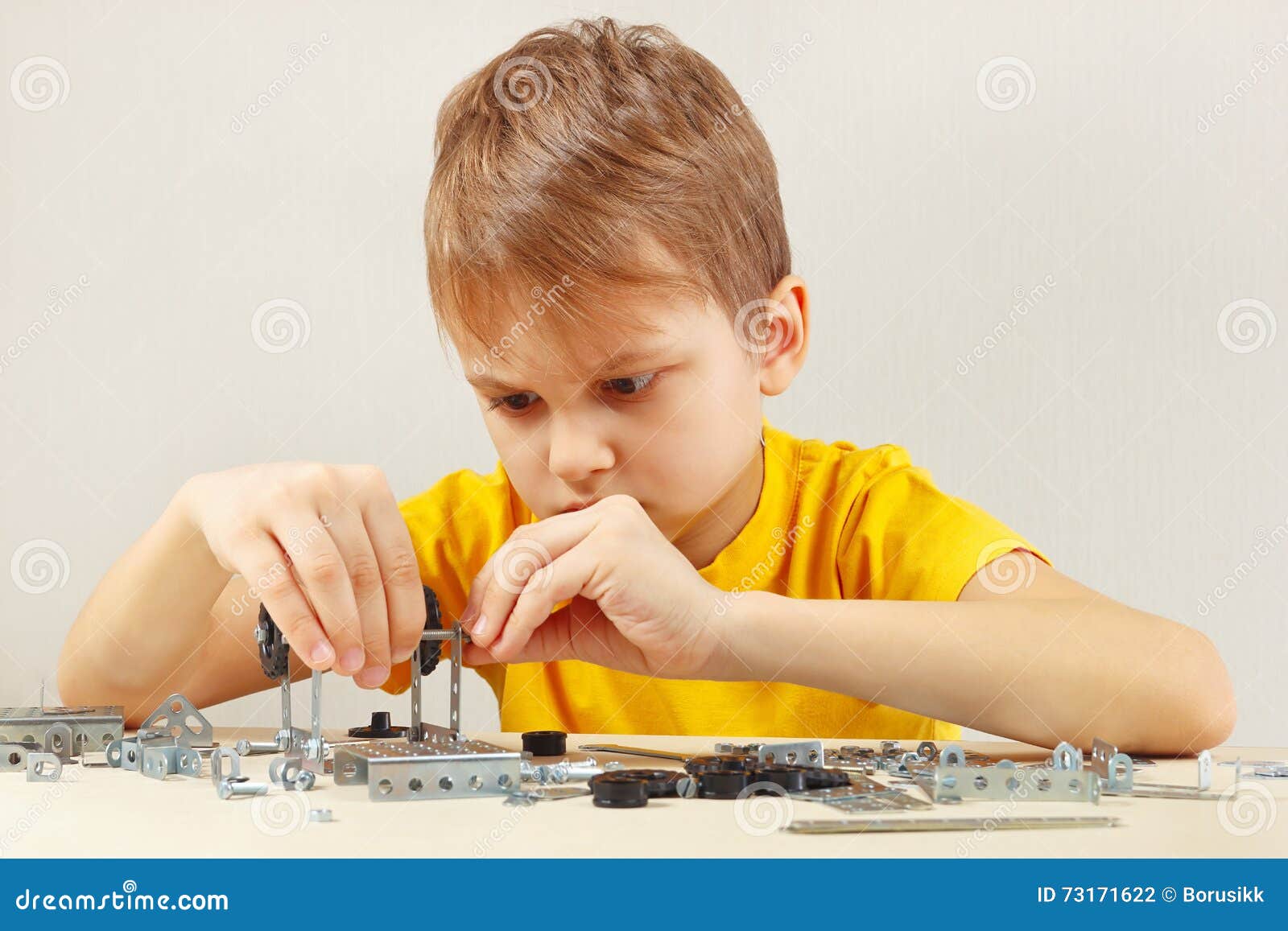 Little Serious Engineer Plays with Metal Constructor at Table Stock ...