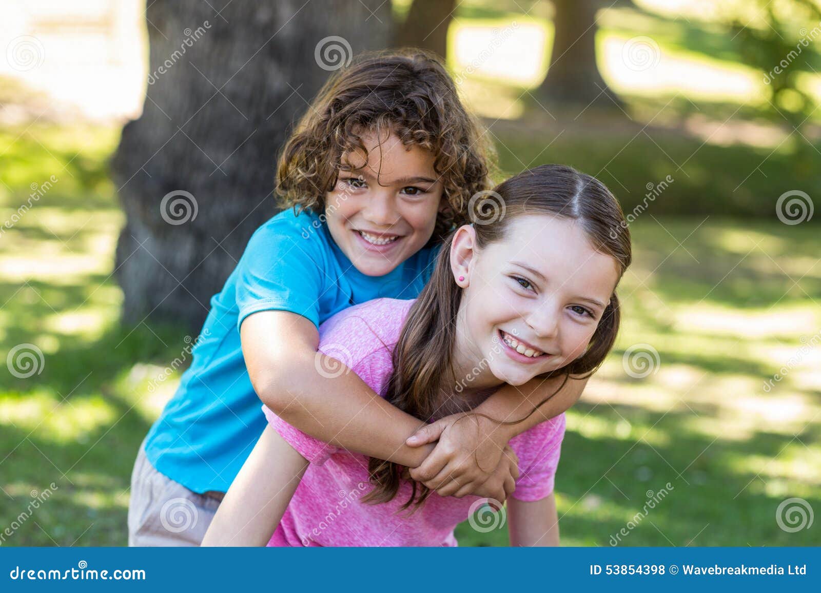 Little Siblings Smiling at Camera Stock Photo - Image of siblings ...